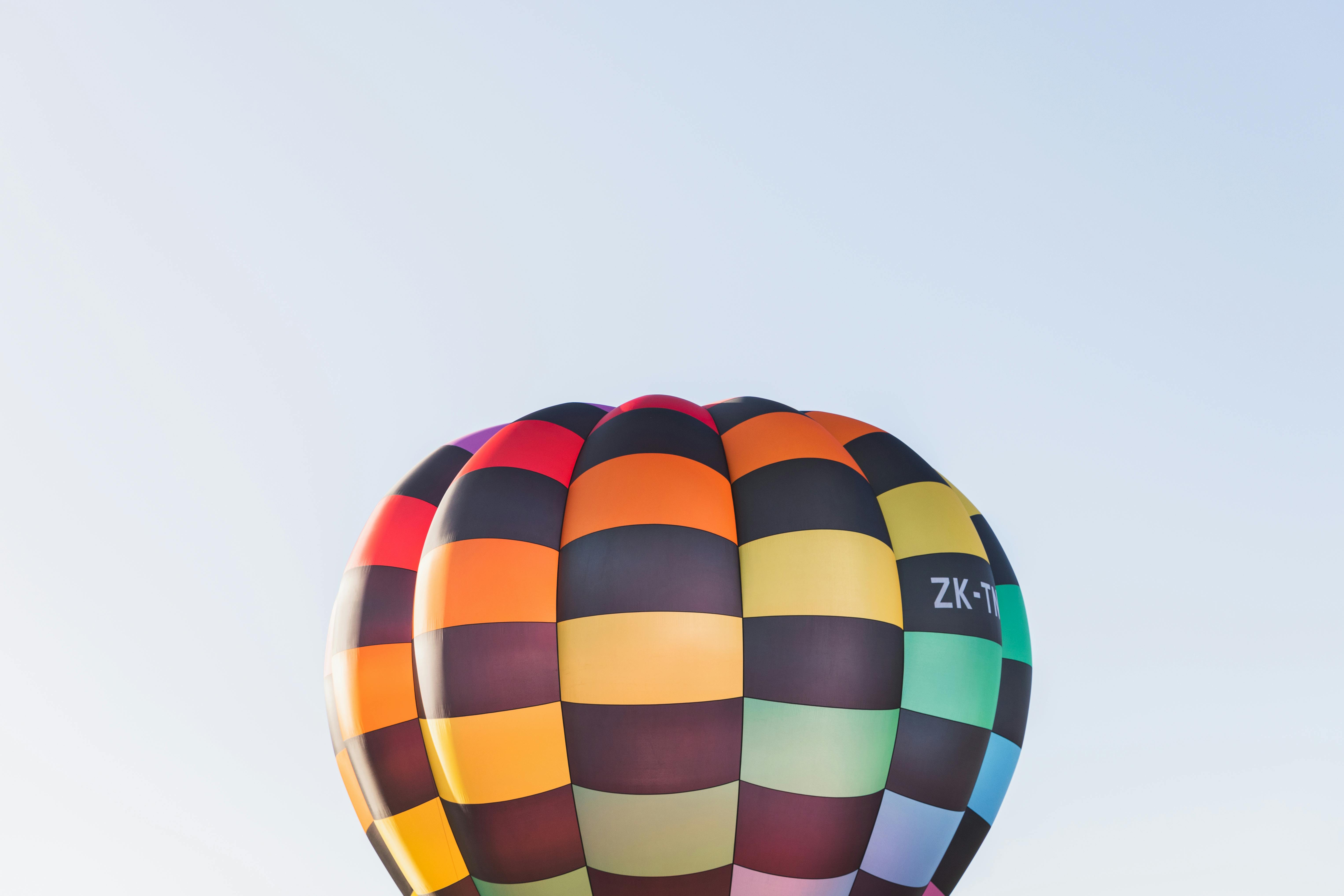 Colorful Balloons on String against Clear Sky · Free Stock Photo