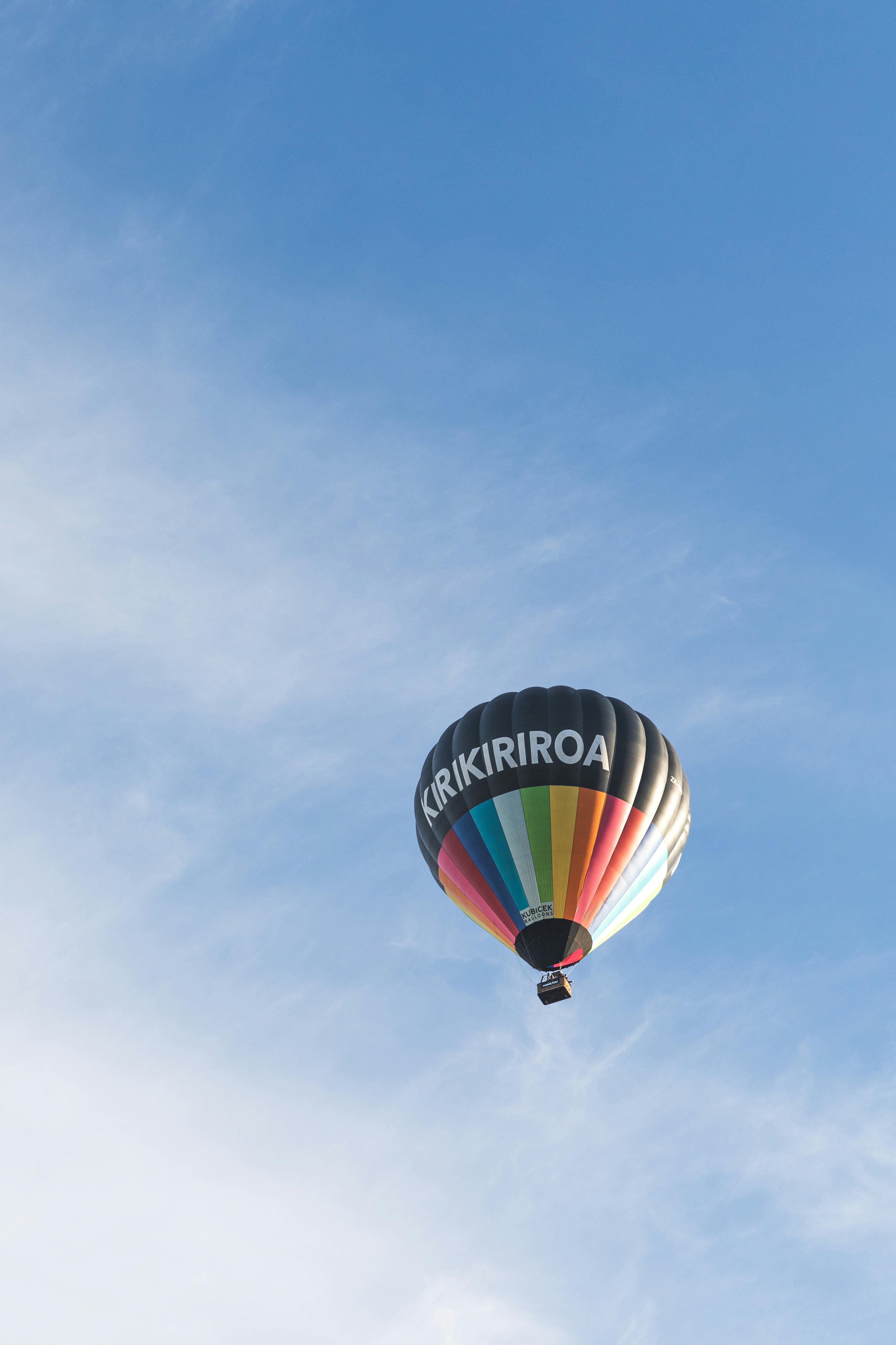 Hot Air Balloon Flying Under Blue Sky during Daytime · Free Stock Photo