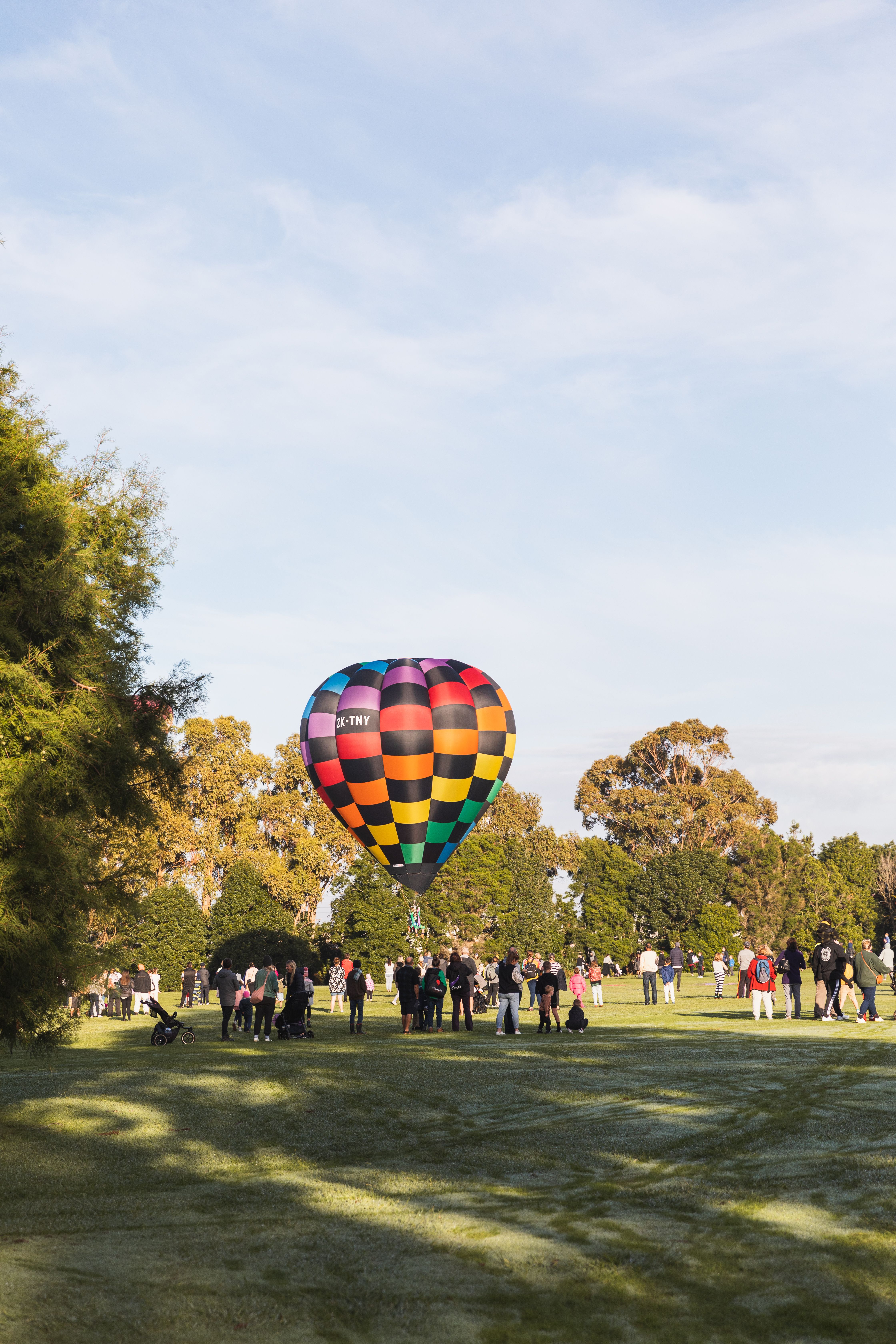 People and Colorful Hot Air Balloon in Summer Park · Free Stock Photo