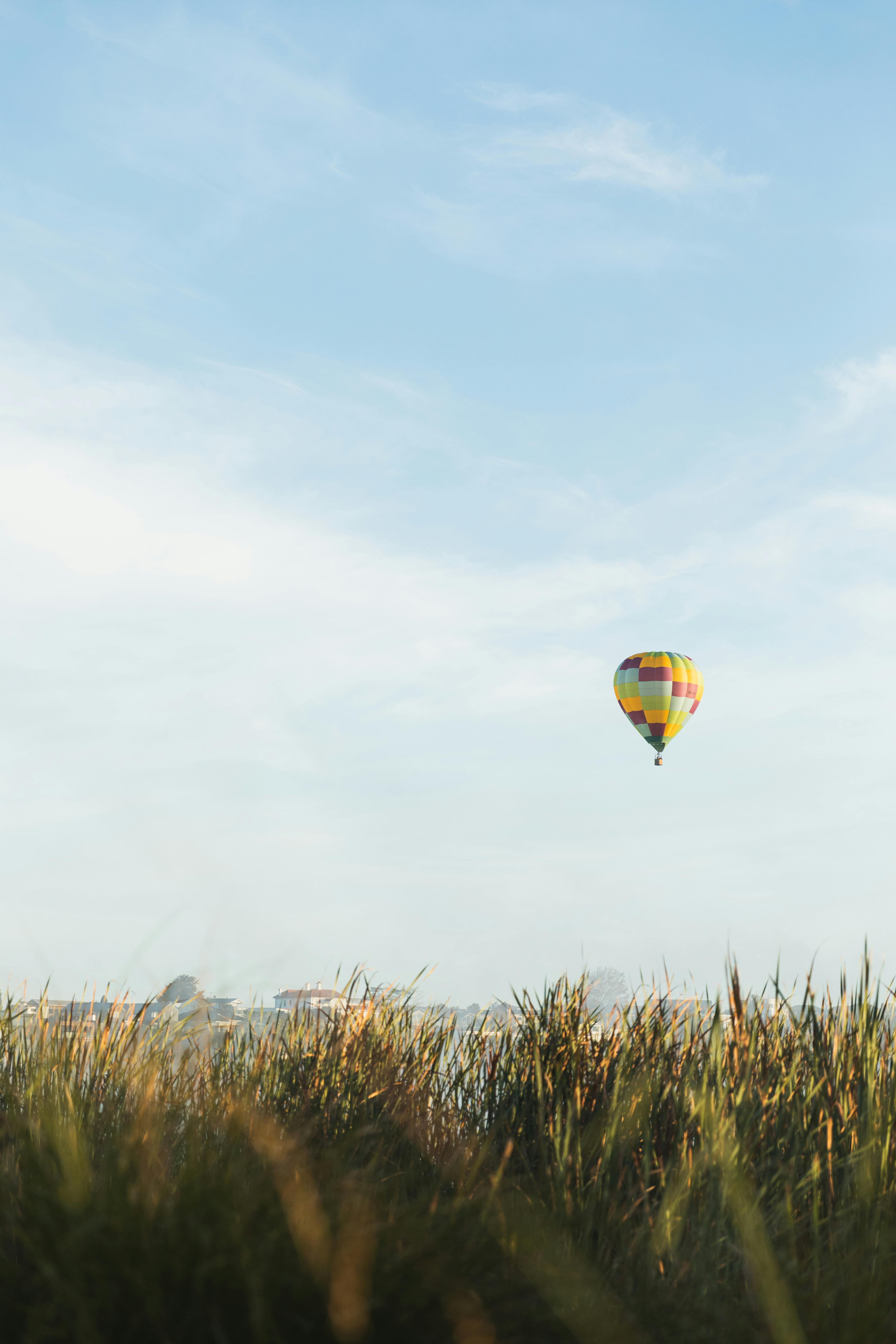 Checkered Hot Air Balloon Flying over Hamilton · Free Stock Photo
