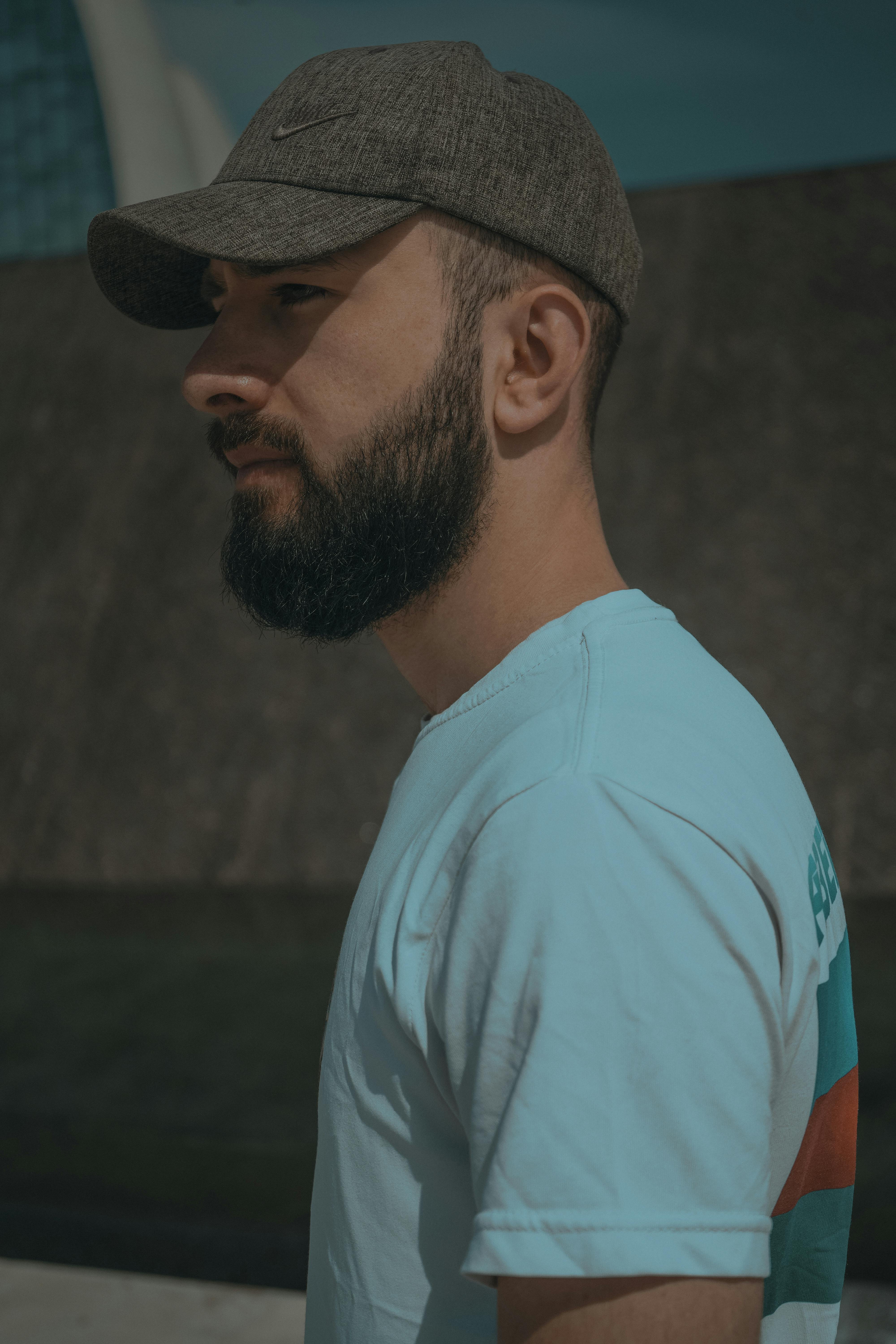 Grayscale Photo of Man Wearing Snapback Cap · Free Stock Photo