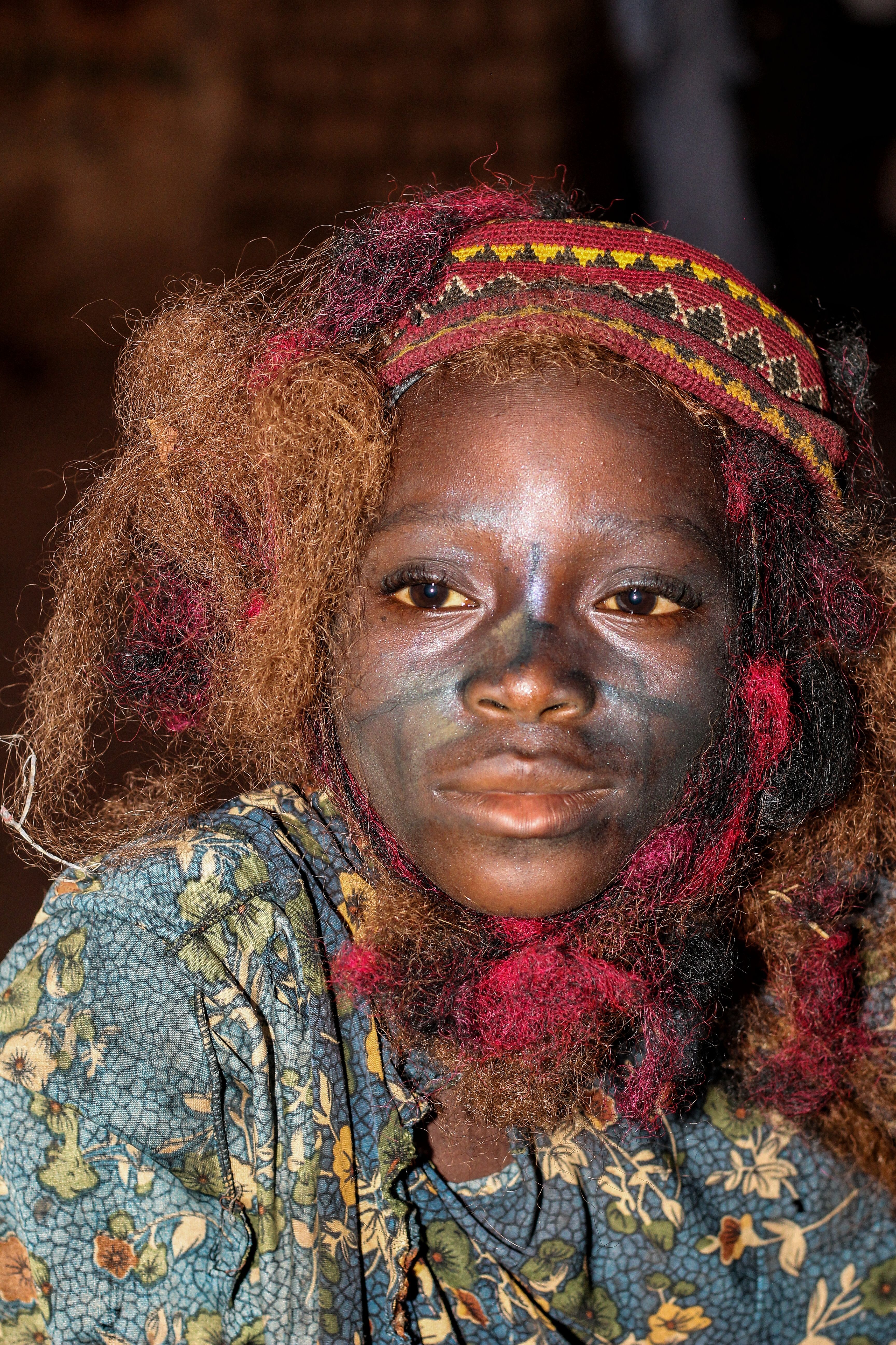 Portrait of a Woman with Painted Face and Hair · Free Stock Photo