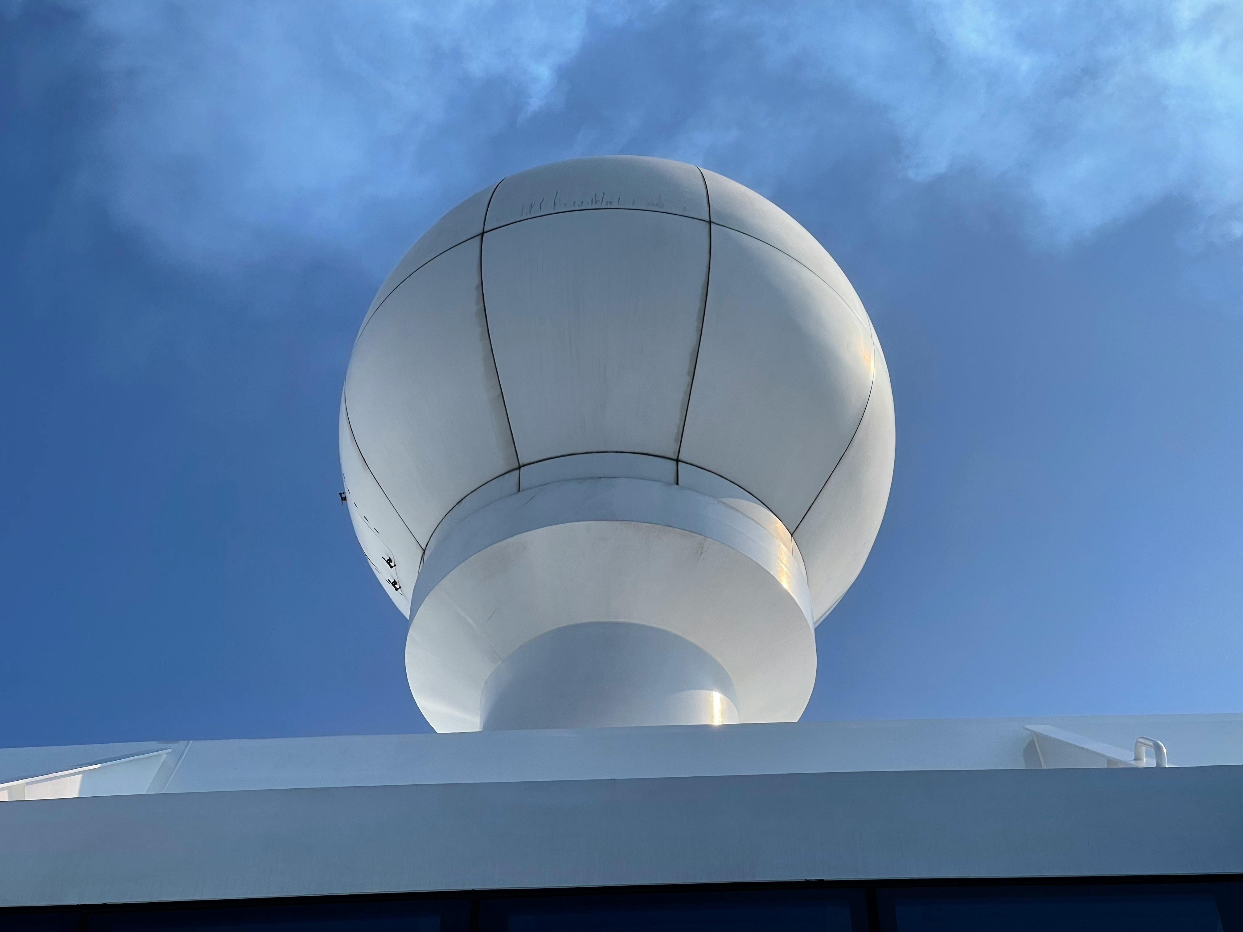 Cloud over Balloon-shaped Installation on Roof · Free Stock Photo