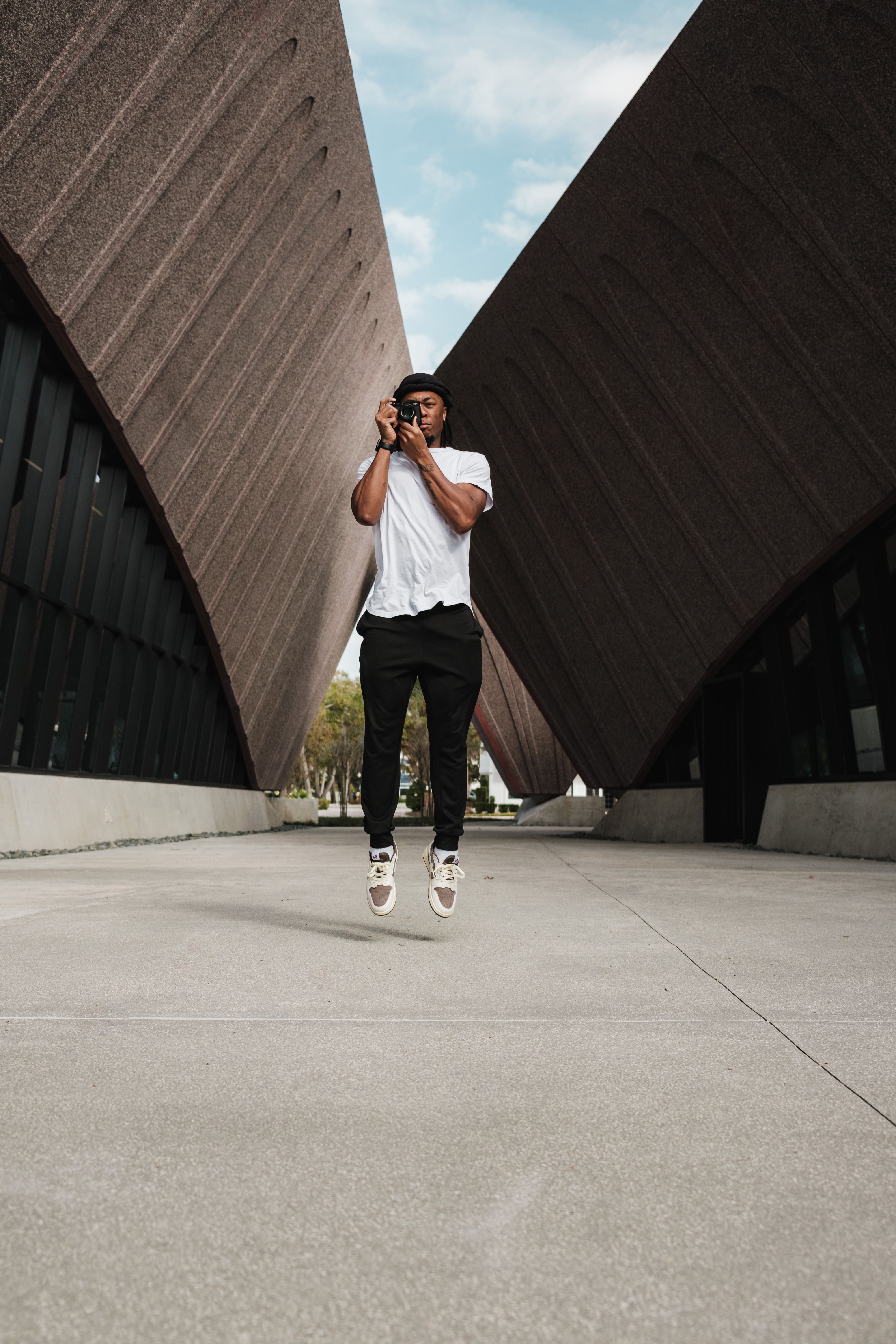 Man with Camera Jumping · Free Stock Photo