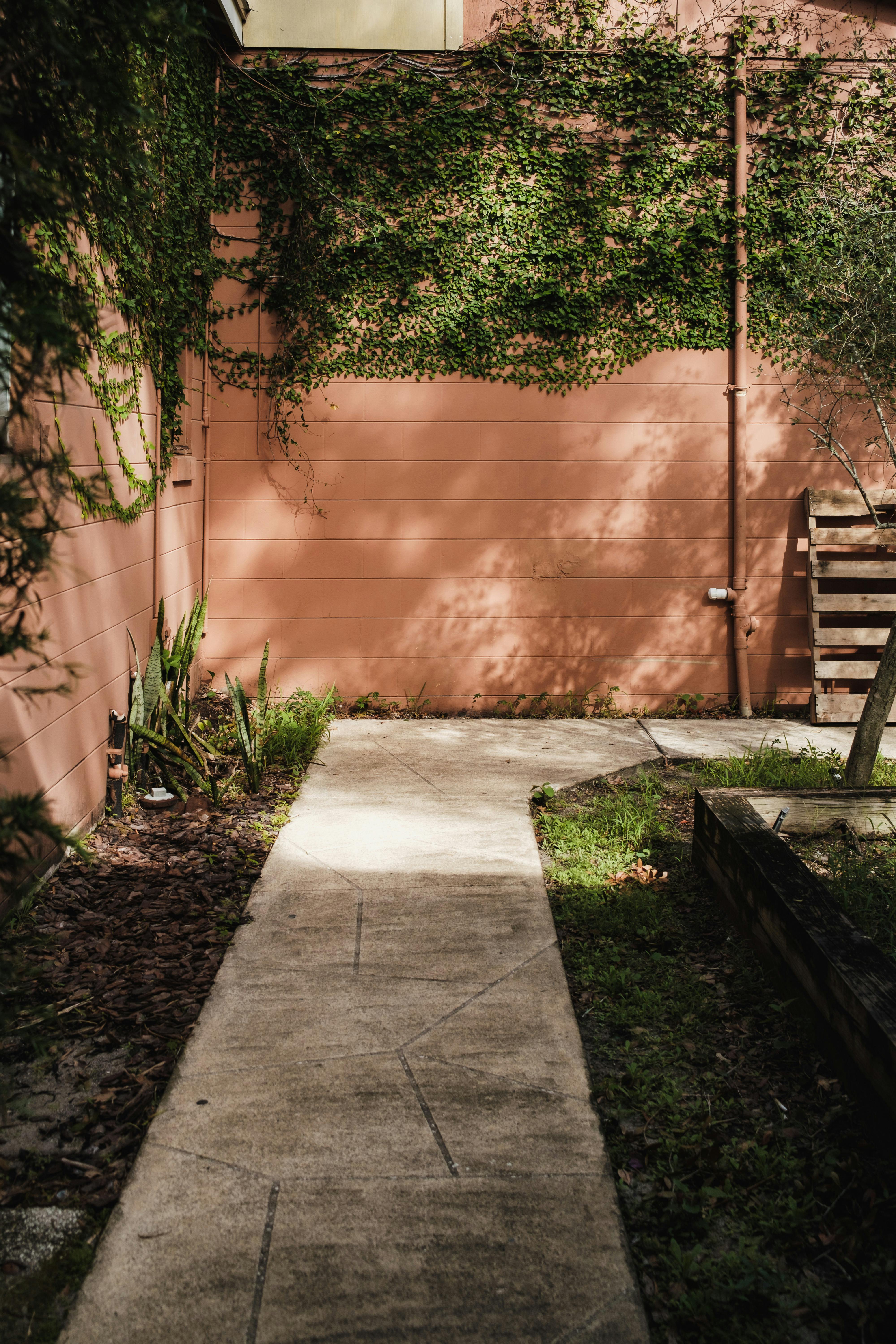 Gate and Stone Walls in Garden · Free Stock Photo