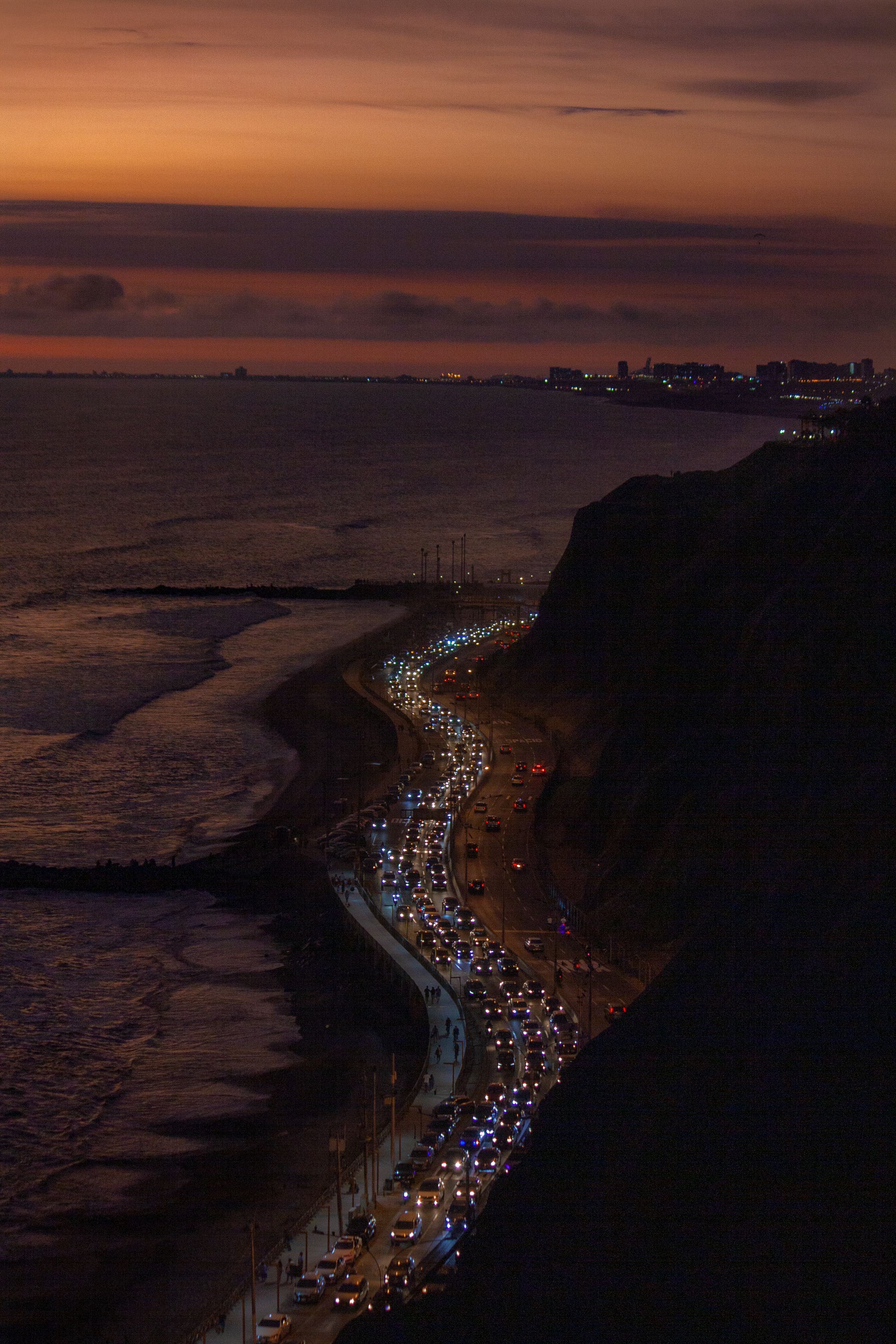 Photo of a Traffic Jam on a Coastal Road during Sunset · Free Stock Photo