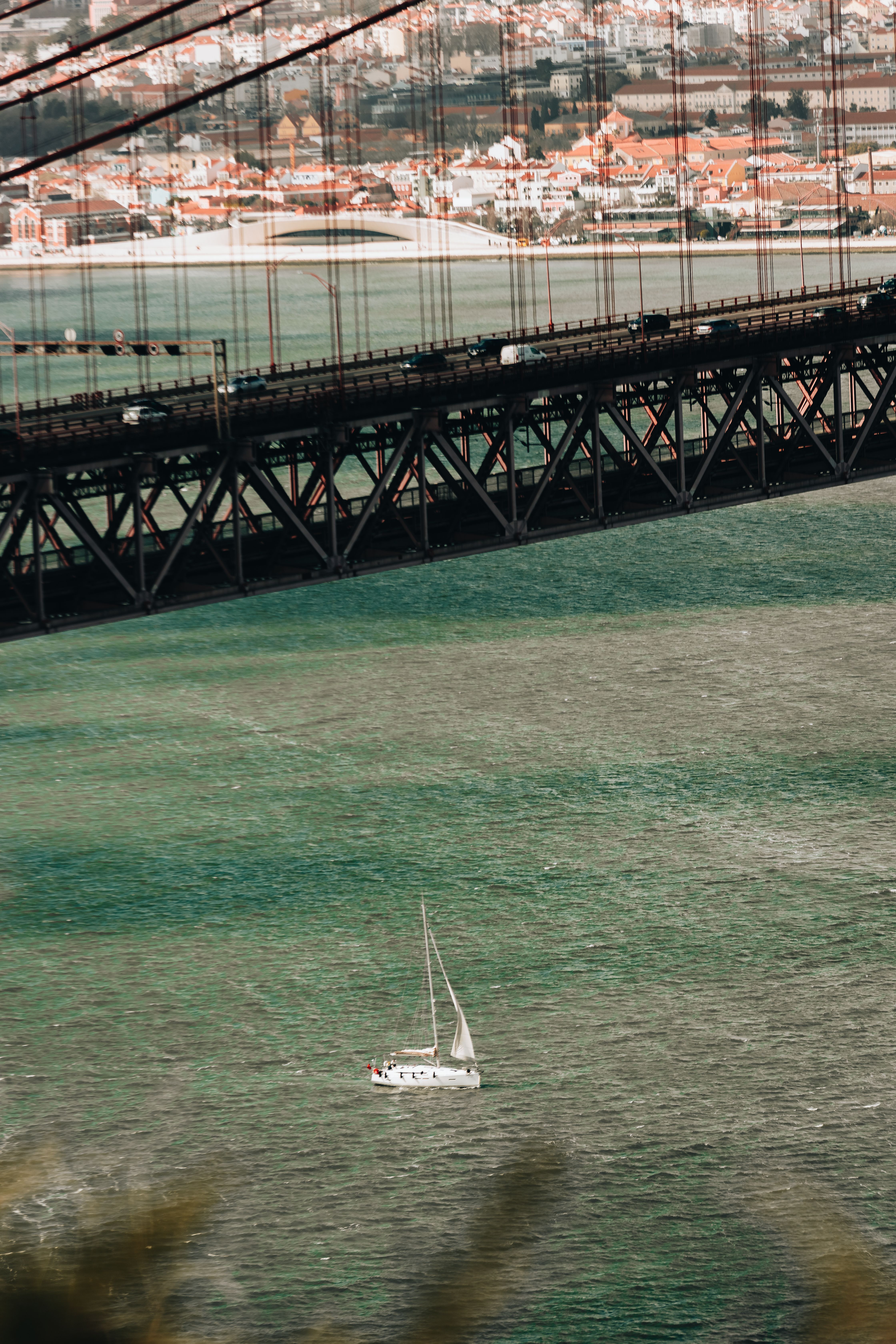 Sailboat Sailing under Bridge · Free Stock Photo