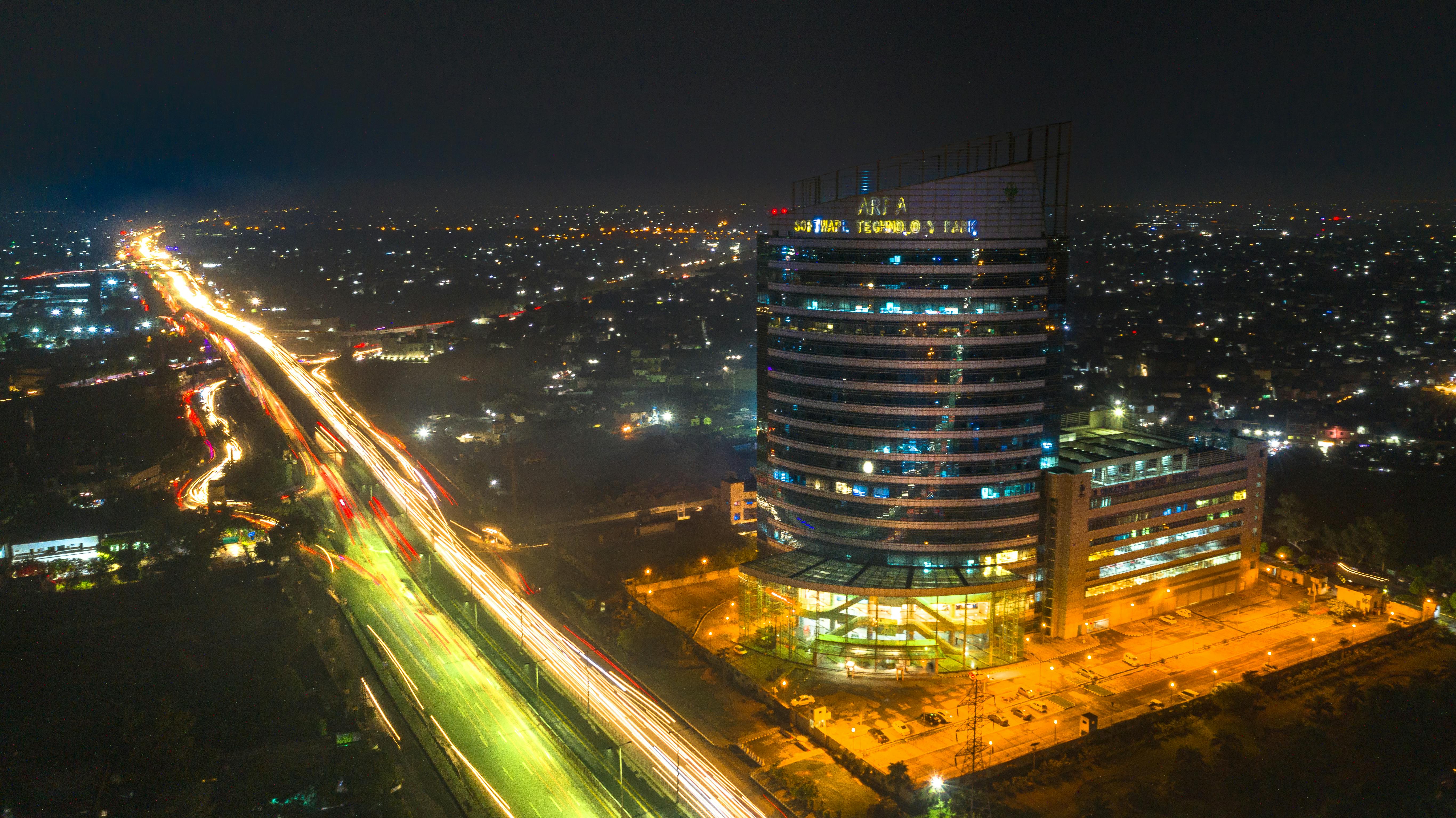 Traffic on Road by Skyscraper in Lahore, Pakistan at Night · Free Stock ...