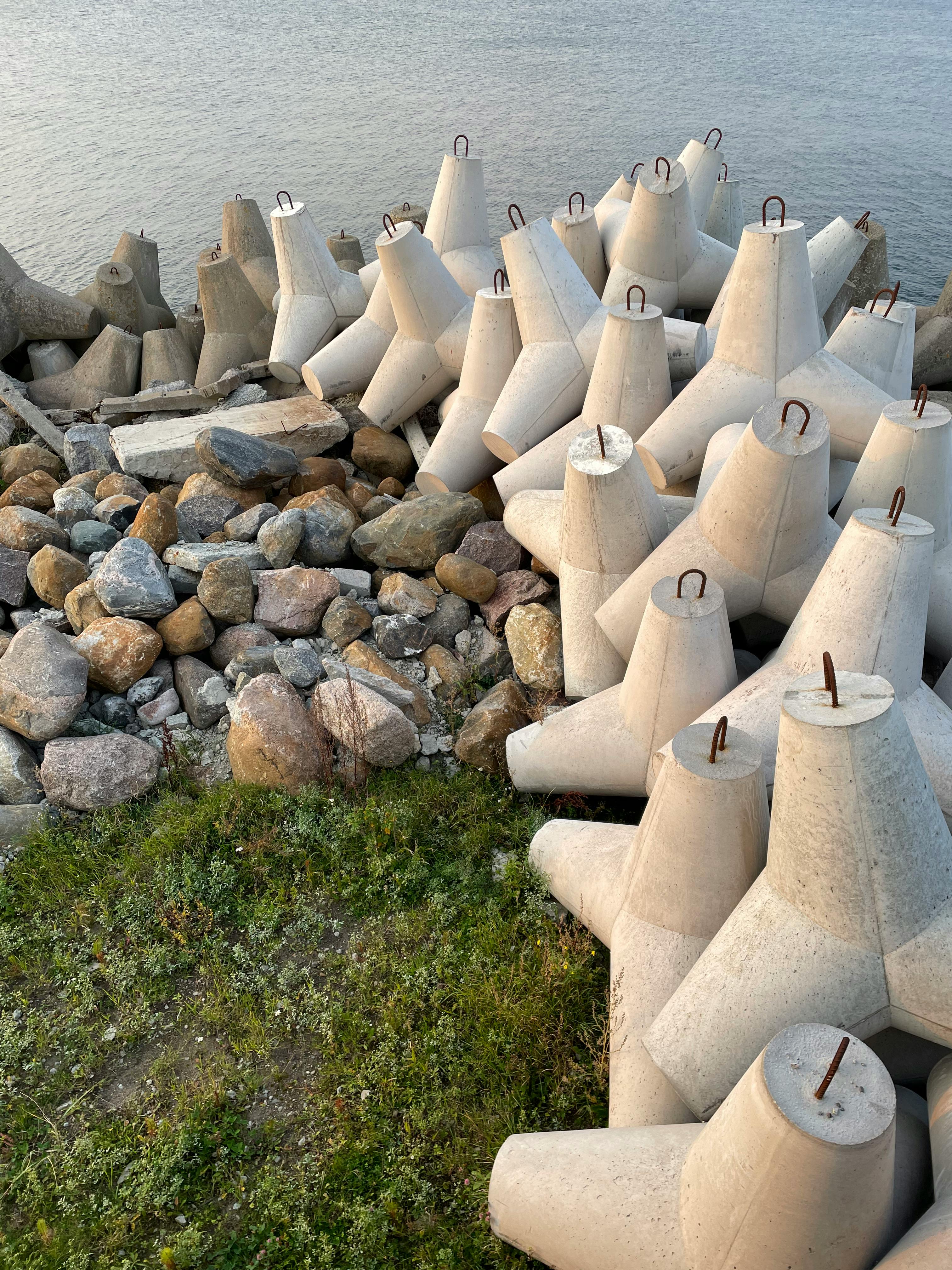 Cement Breakwater on Sea Shore · Free Stock Photo