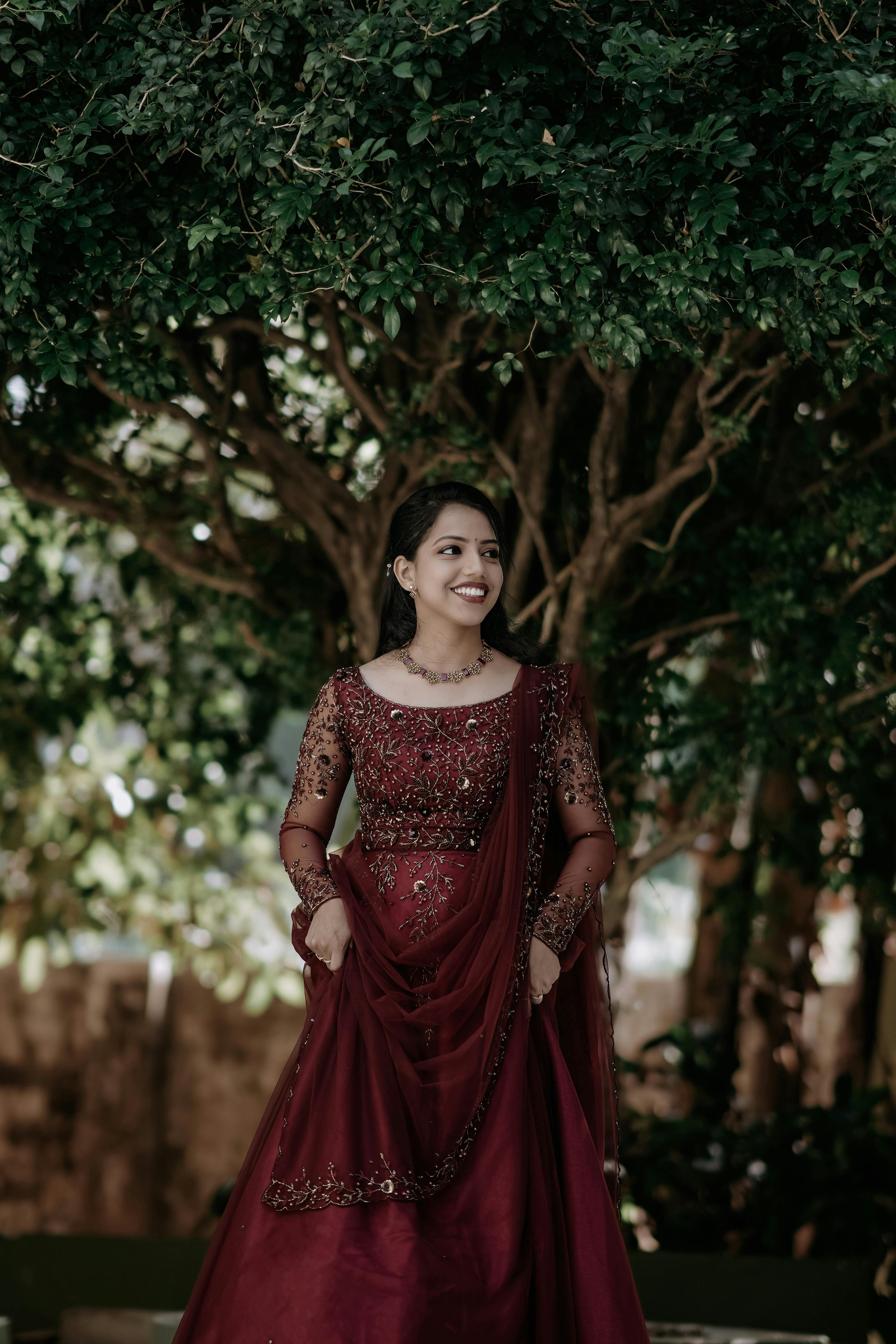 Woman in Traditional Clothing on Lakeshore · Free Stock Photo