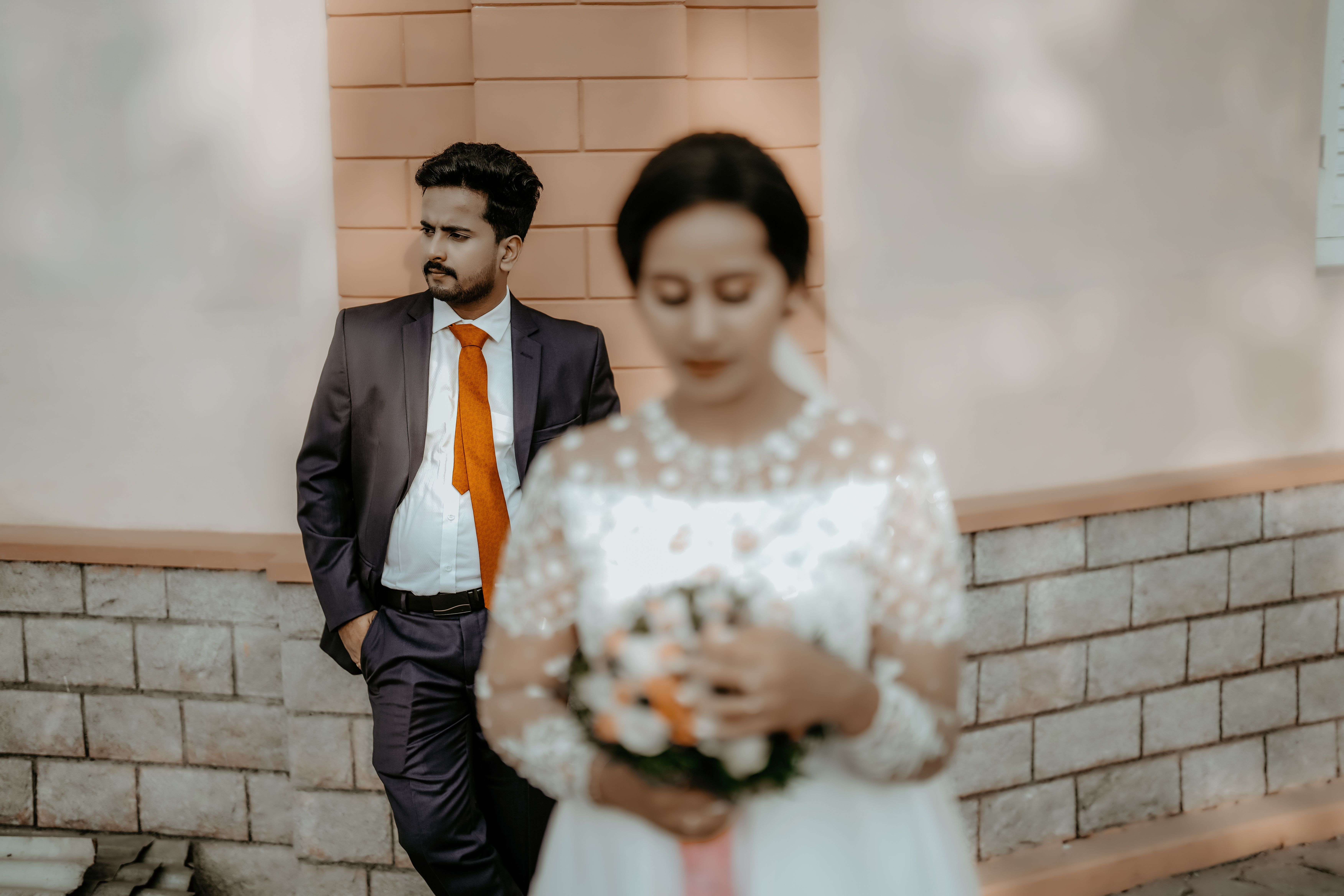 Groom Stanidng behind Bride with Bouquet · Free Stock Photo