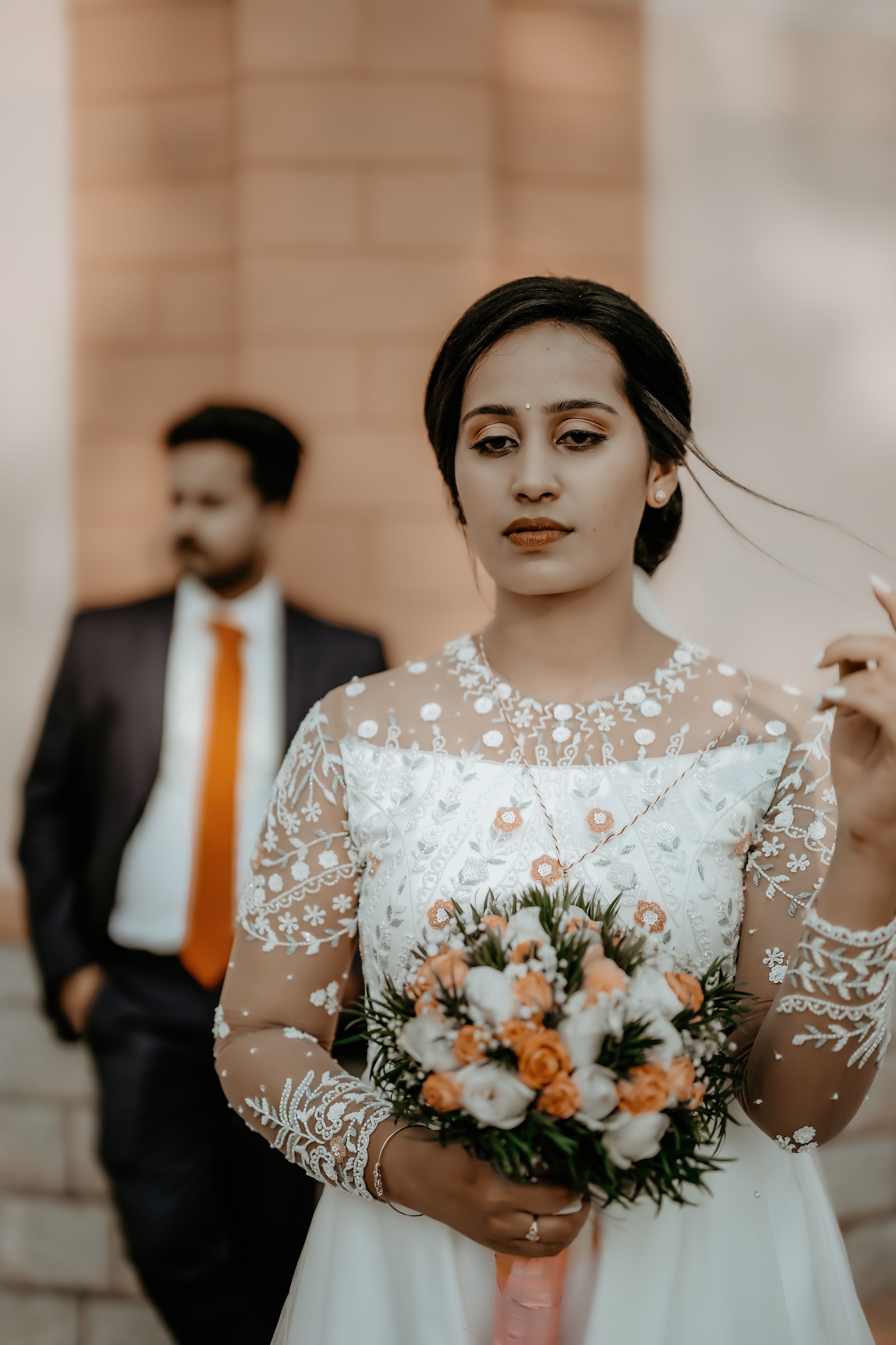Bride Posing by Huge Building Door · Free Stock Photo