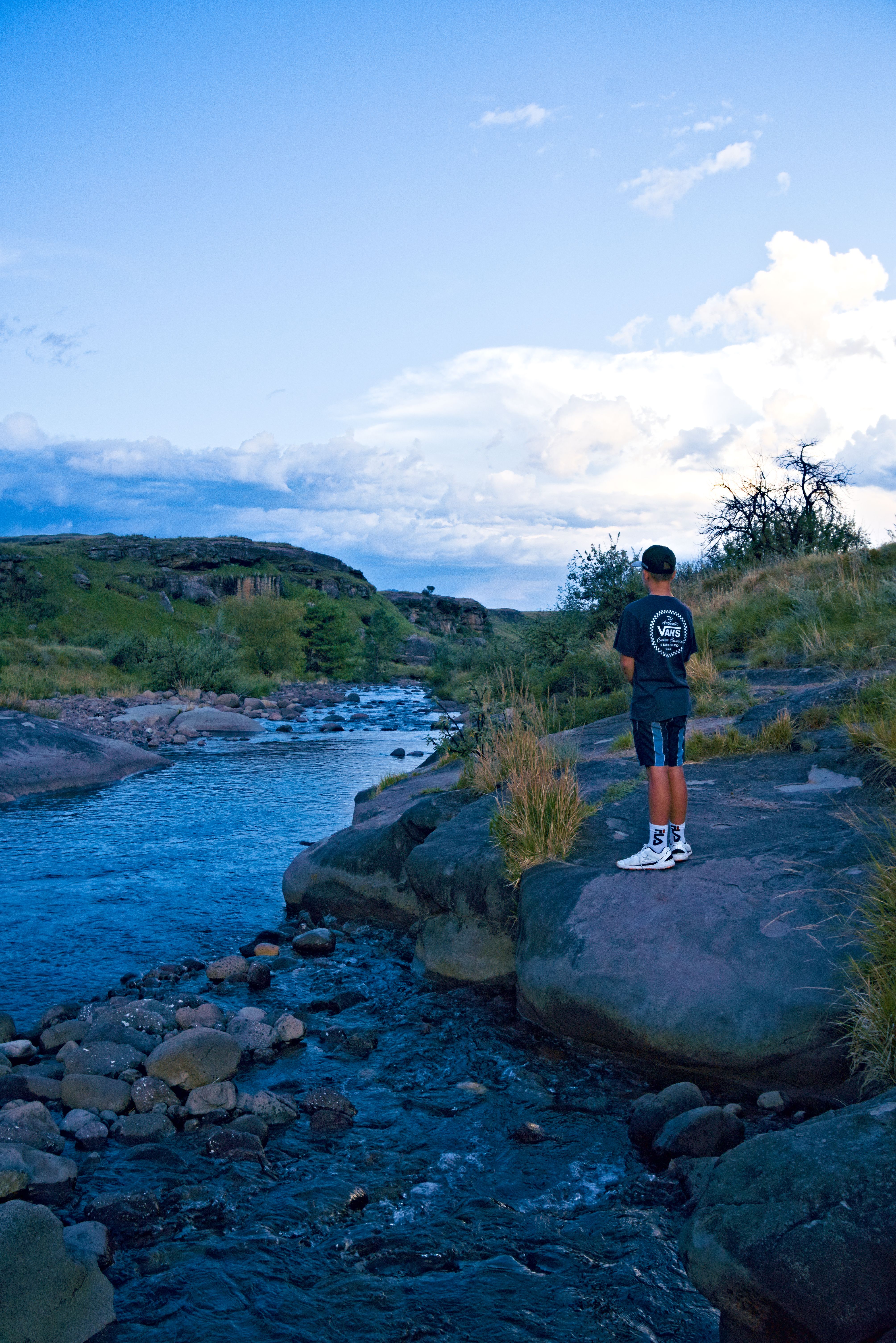 Boy Standing near Stream · Free Stock Photo