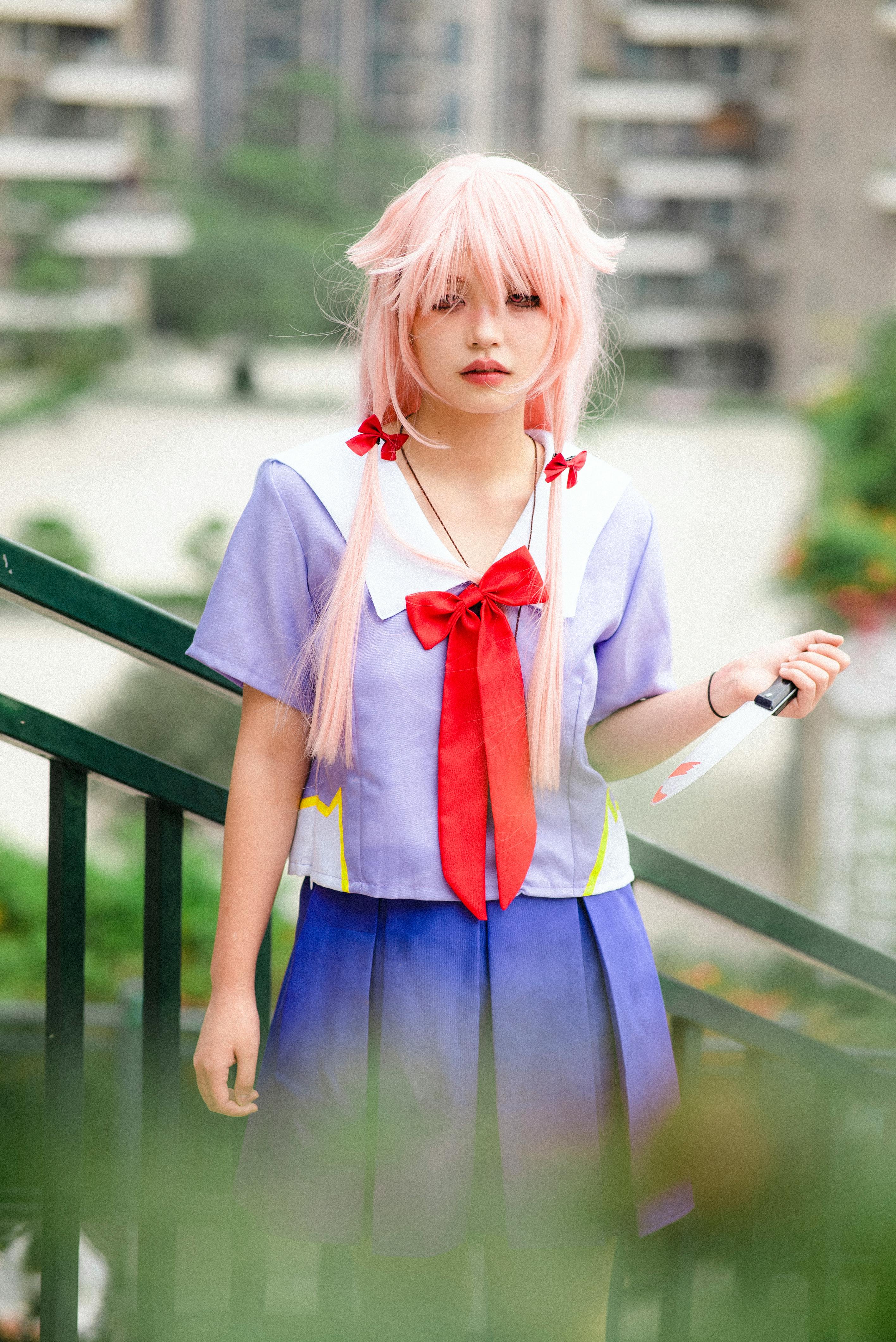 Woman in Cosplay Standing by a Railing · Free Stock Photo