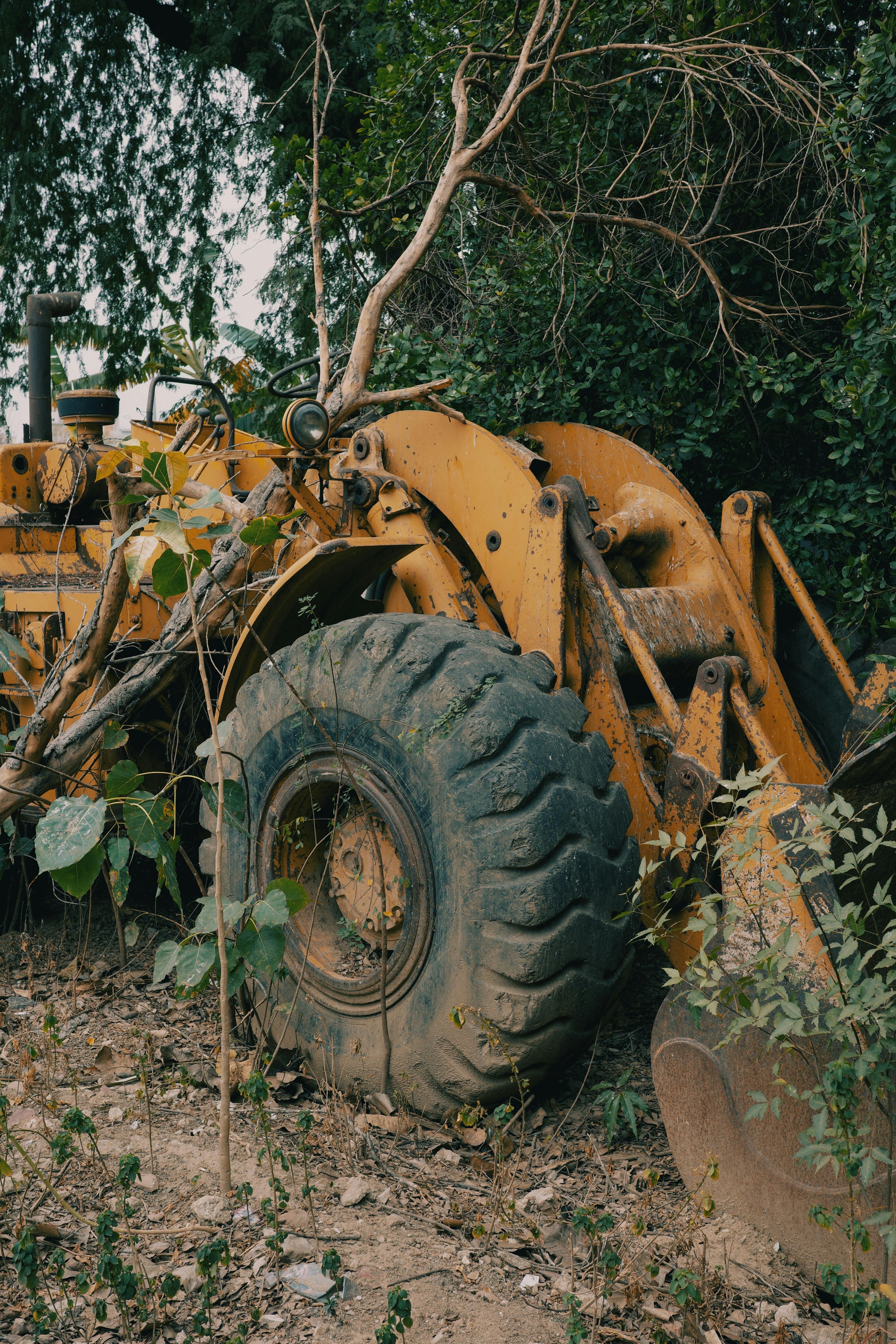 Man Riding Tractor on Brown Field · Free Stock Photo