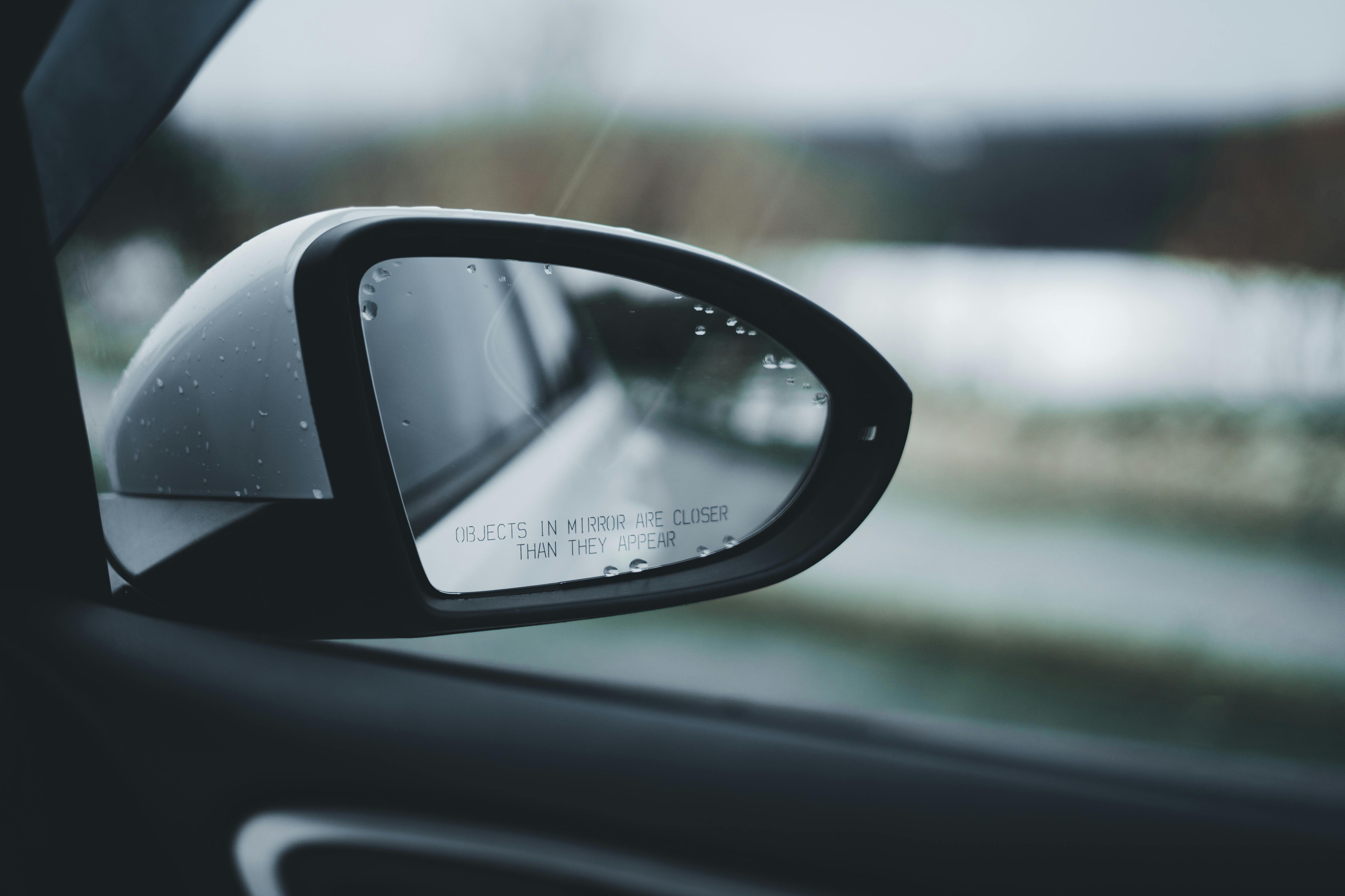 Photo of a Car Mirror with Raindrops · Free Stock Photo
