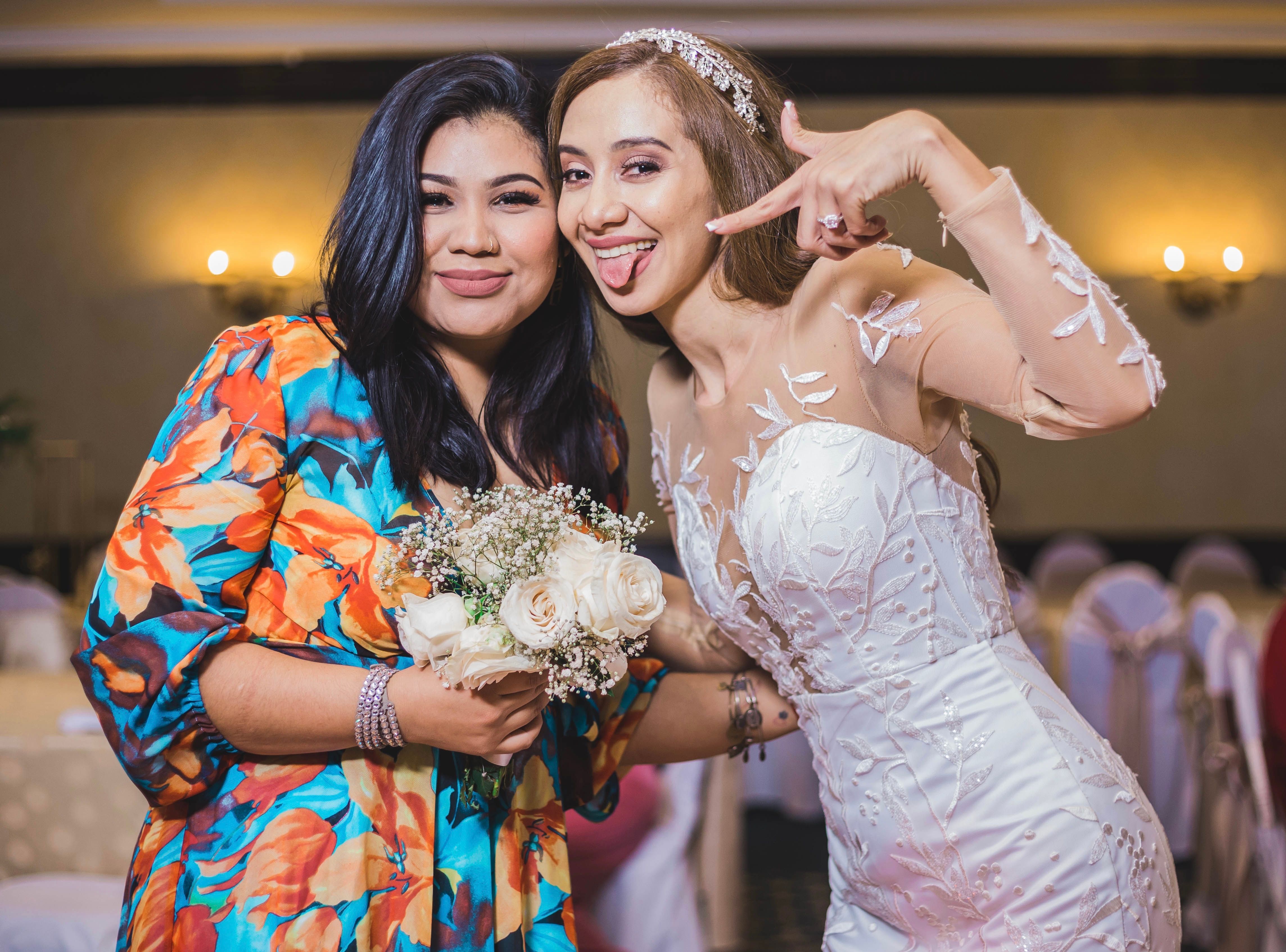 Bride Posing for a Photo with her Friend · Free Stock Photo