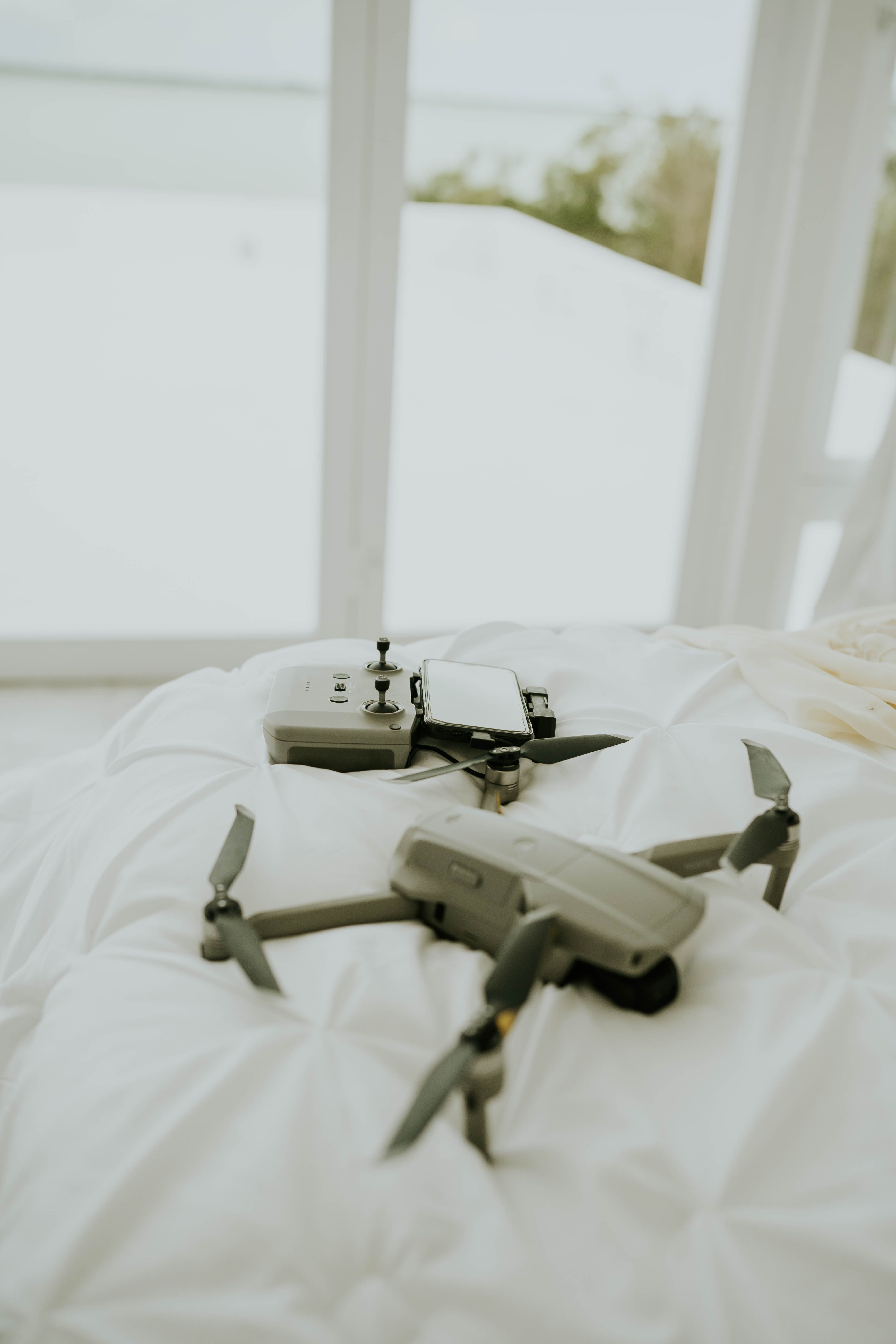Photo of a Drone Lying on a Bed · Free Stock Photo