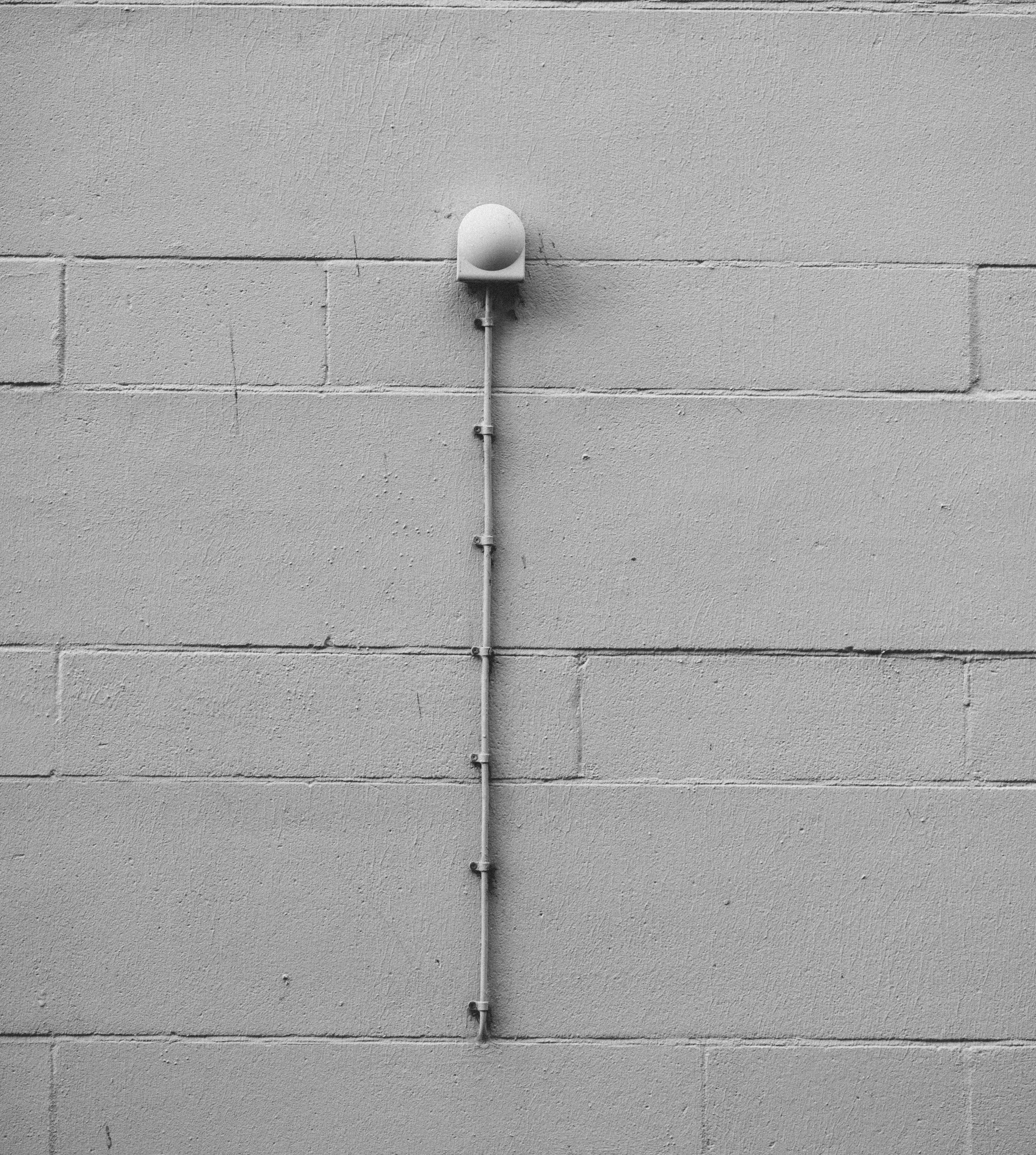 Wire on White Wall · Free Stock Photo