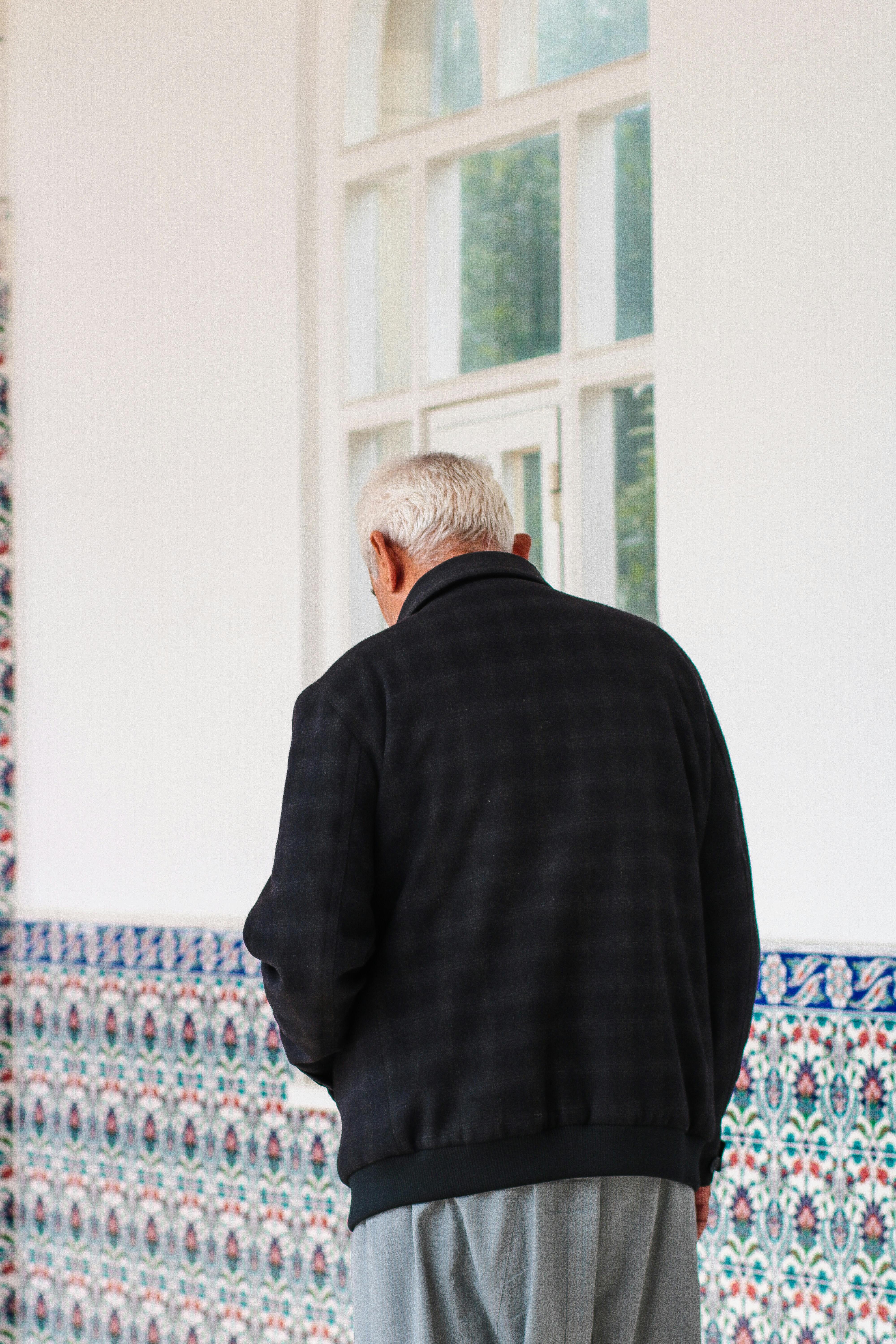 Back View of an Elderly Man Walking next to a Building in City · Free ...