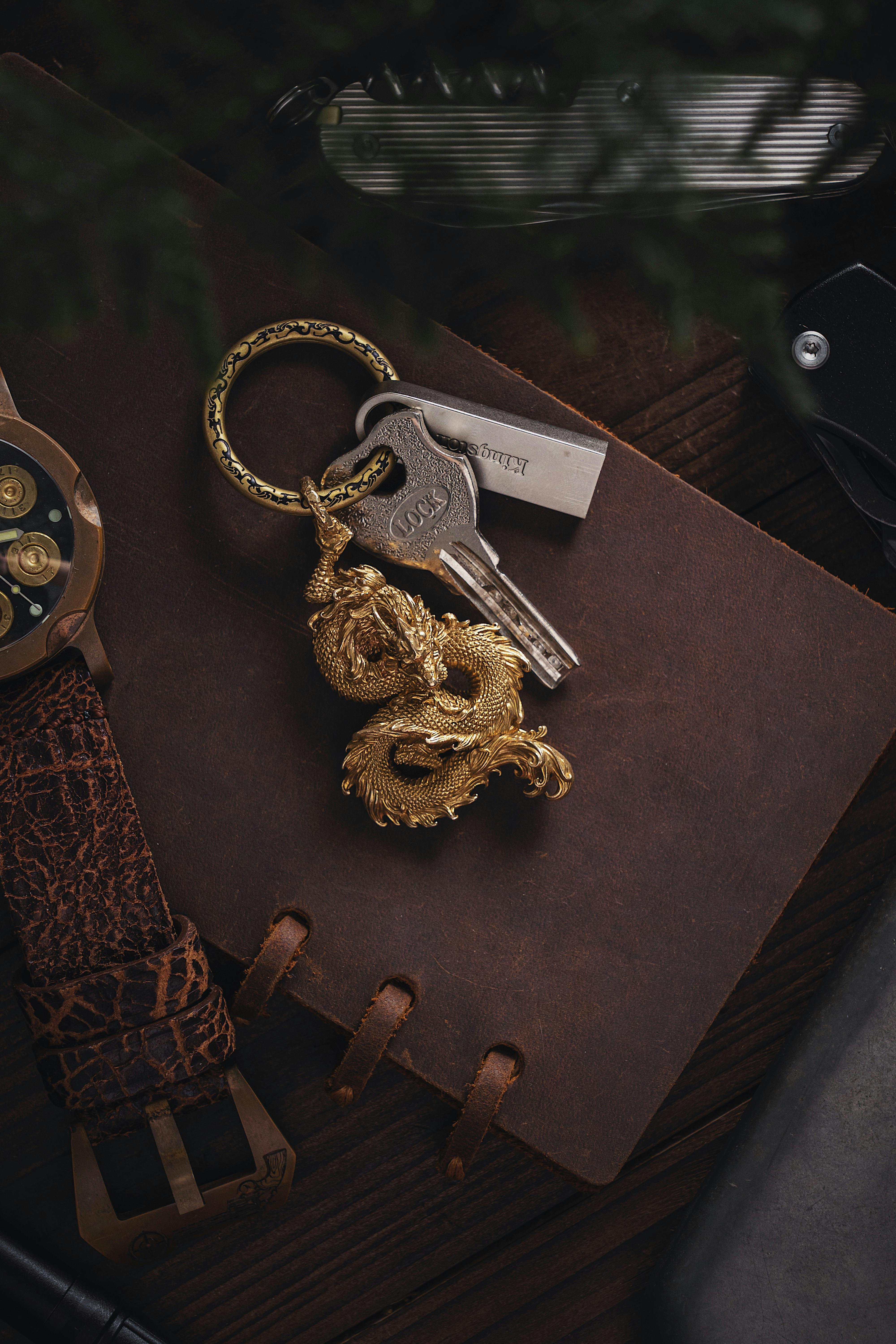 A Dragon Pendant Attached to Keys · Free Stock Photo