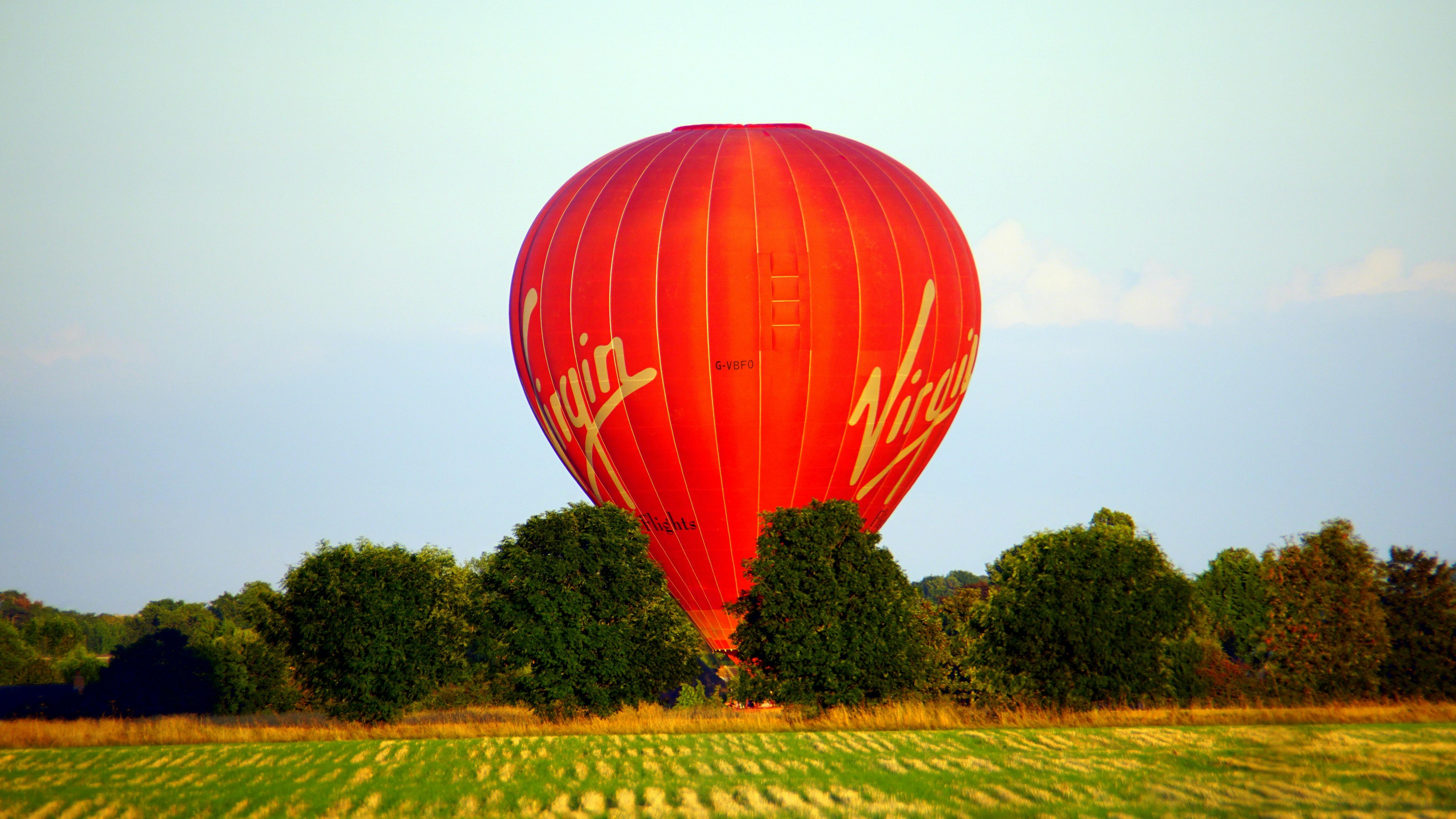 Red Virgin Hot Air Balloon Landscape Photograph · Free Stock Photo