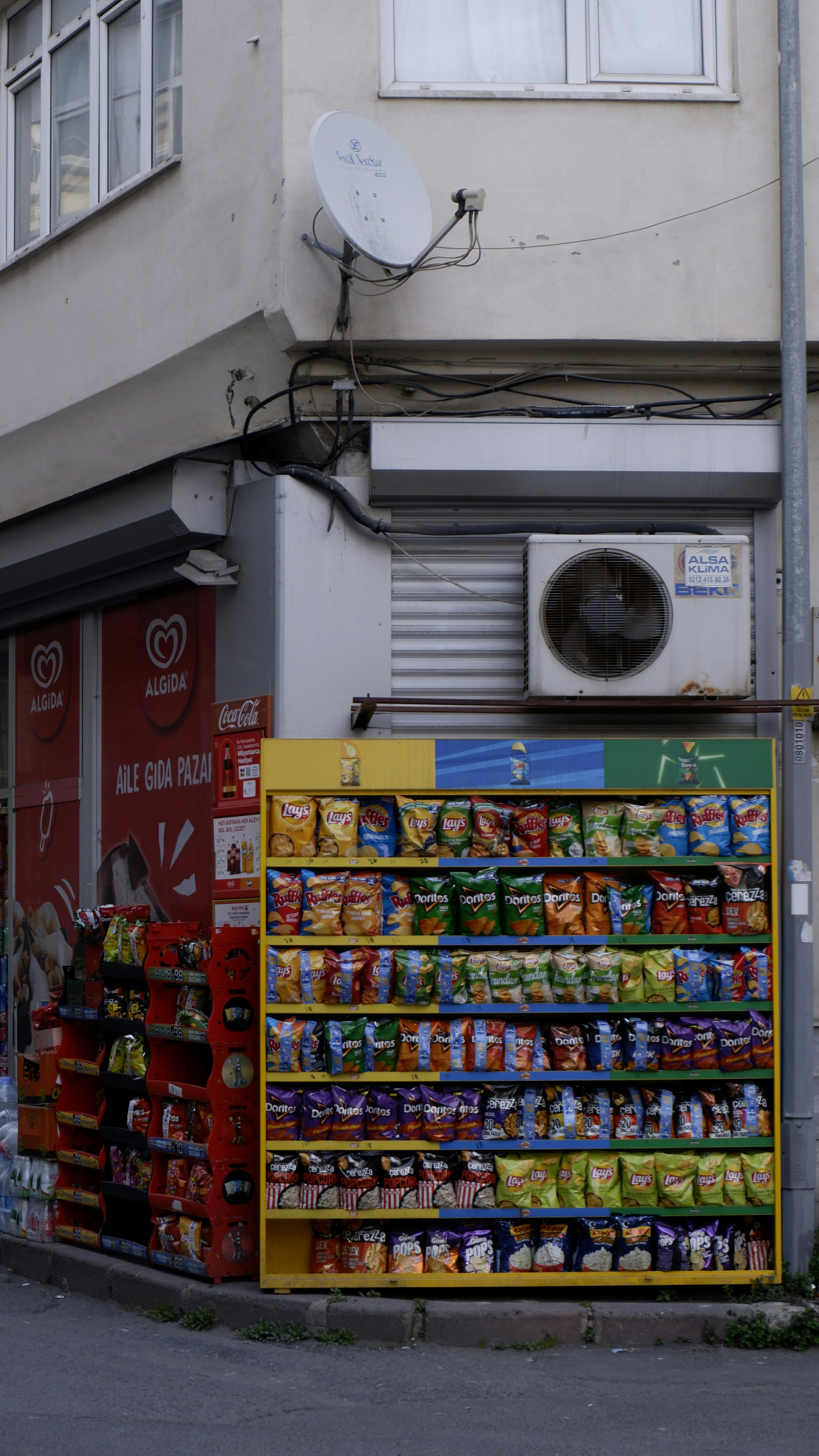 Shelves with Chips on Store Wall · Free Stock Photo