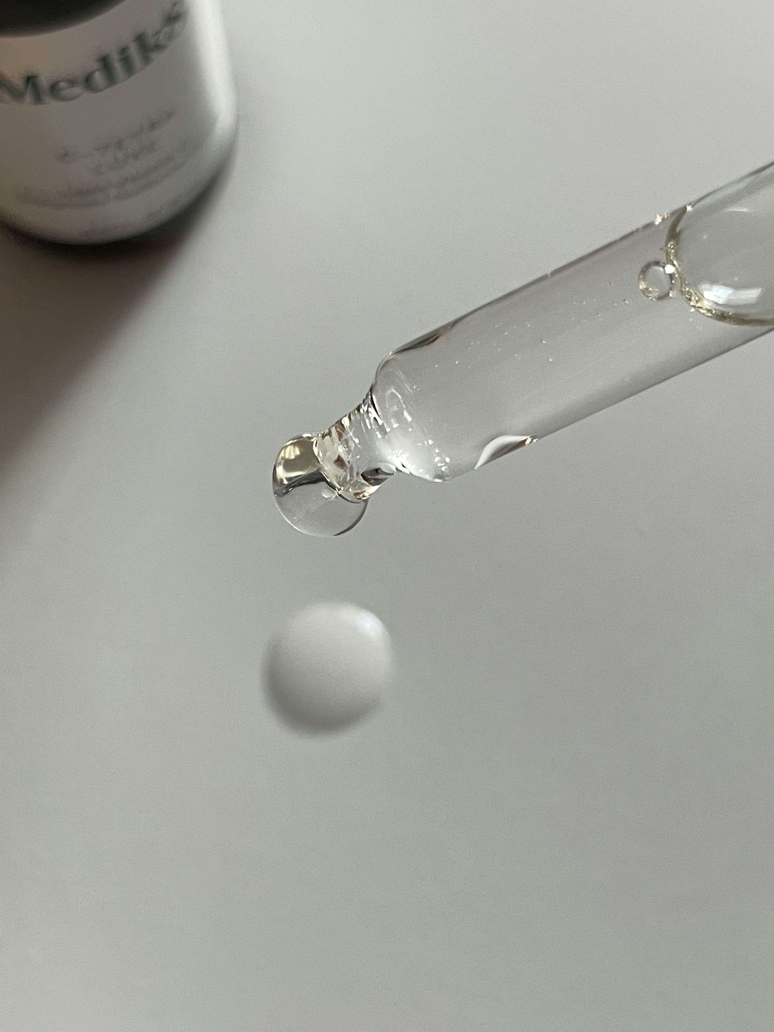 Liquid Drop from Vial · Free Stock Photo