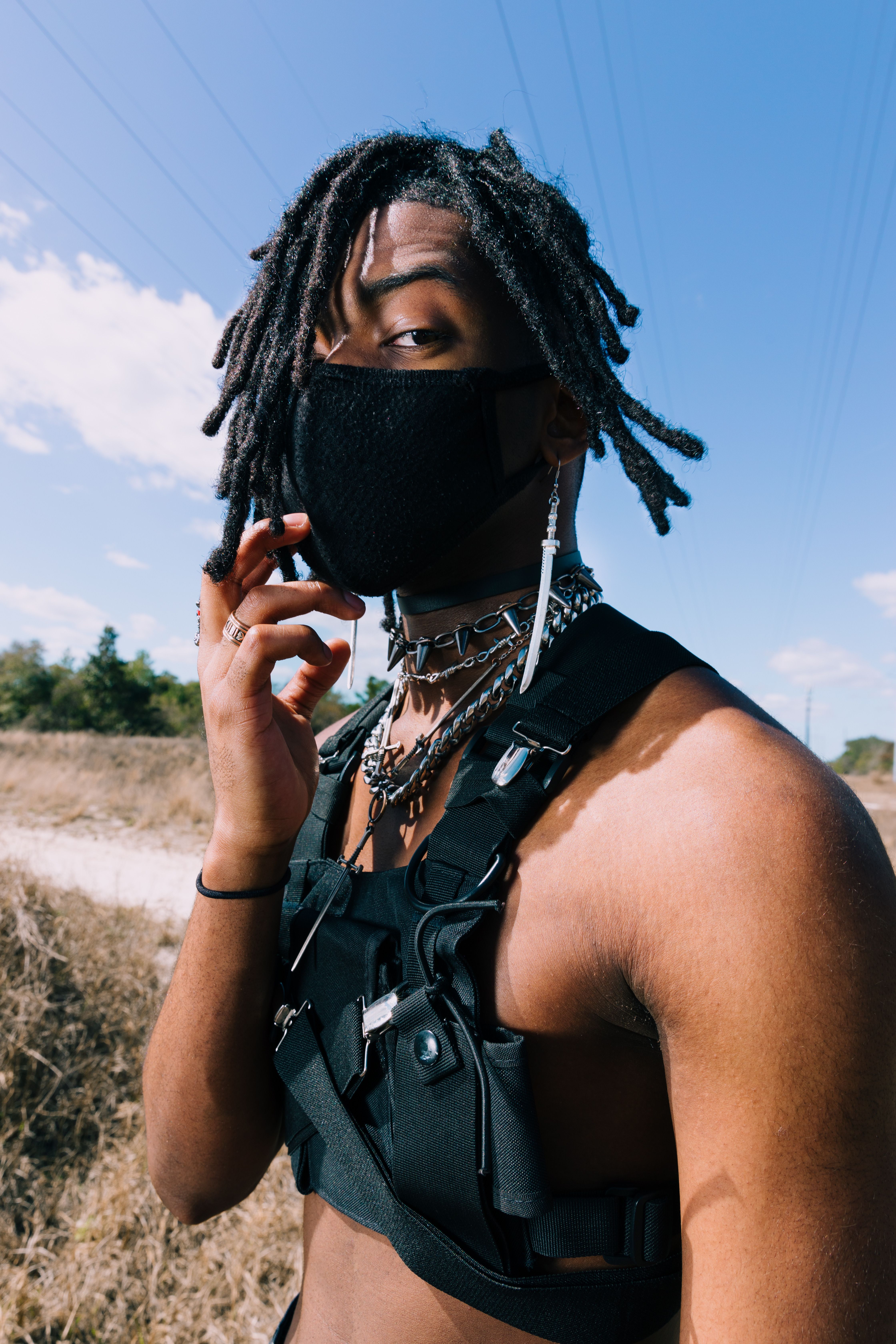 A Man with Dreadlocks Wearing a Mask · Free Stock Photo