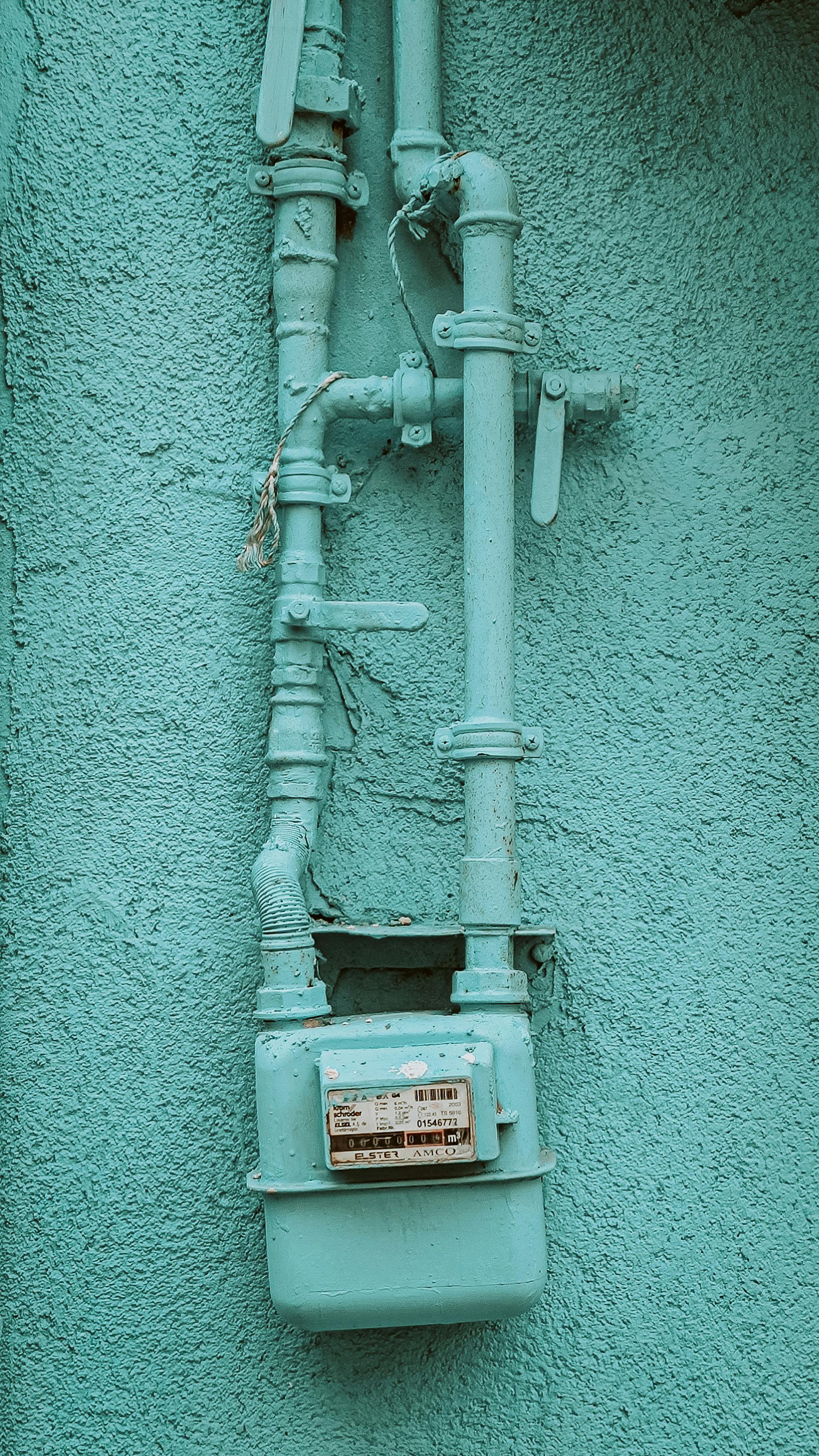 Pipes and Gas Meter Painted in the Color of the House · Free Stock Photo