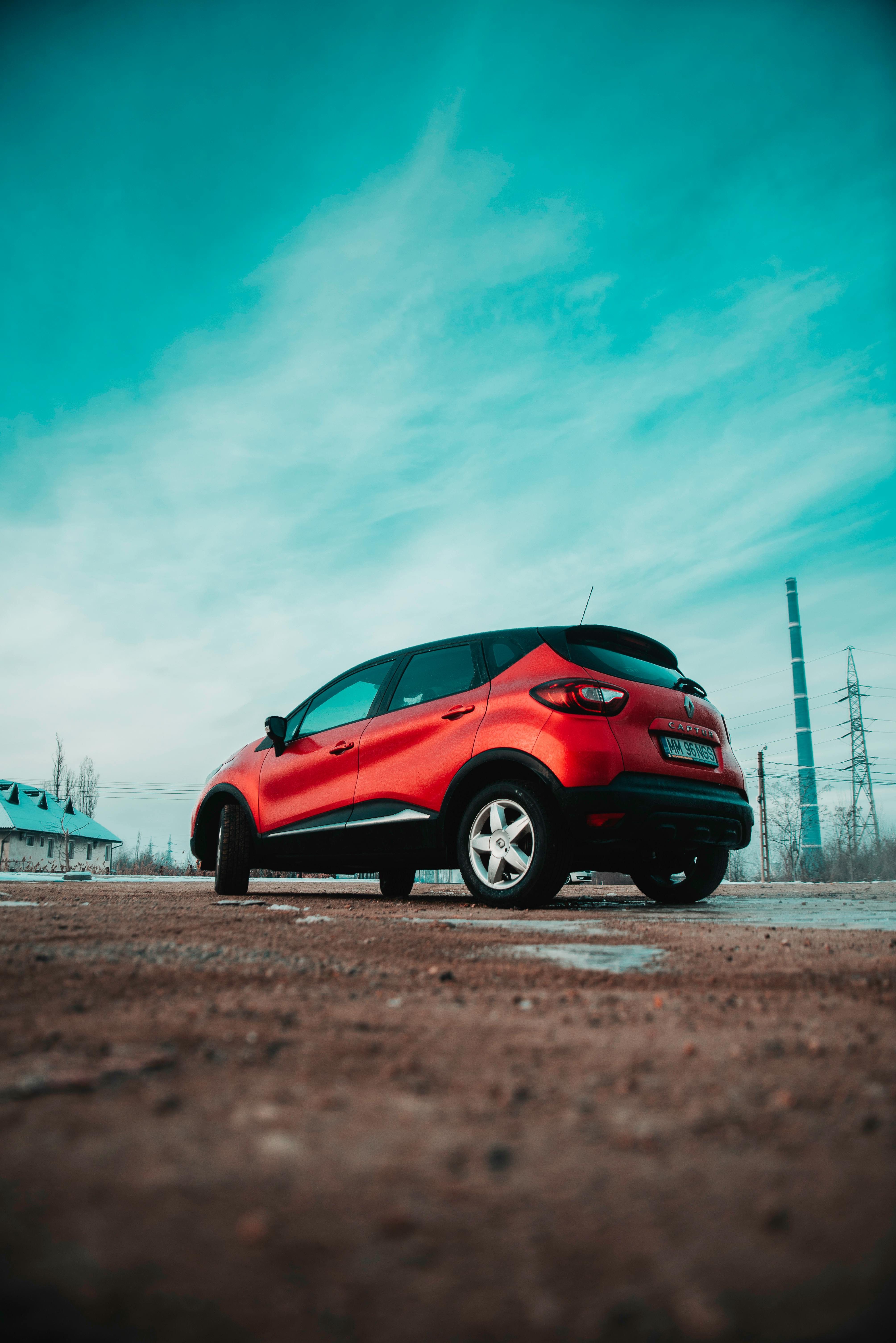 A Red Renault Captur under Blue Sky in Winter · Free Stock Photo