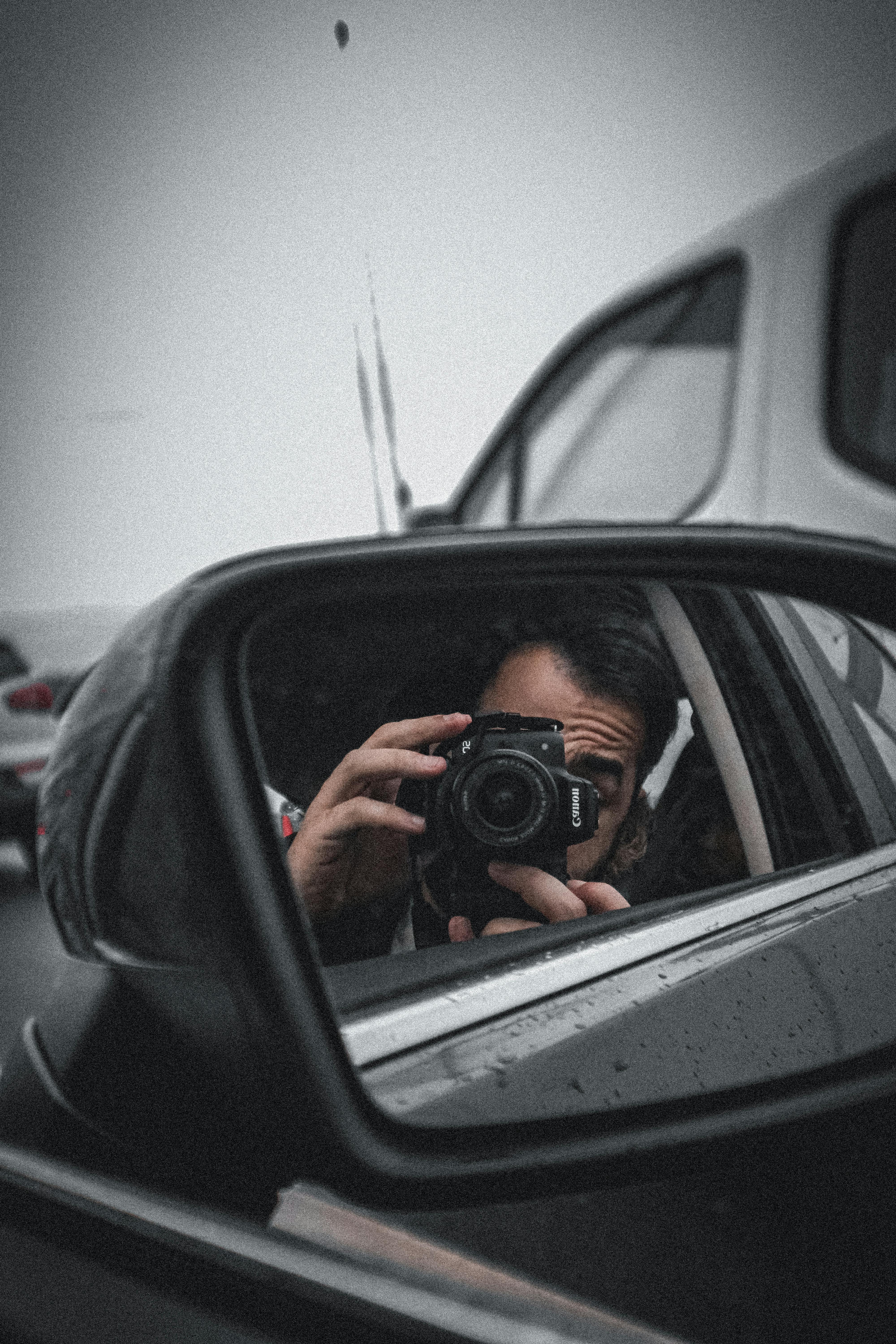 Man with Camera Reflection in Car Mirror · Free Stock Photo