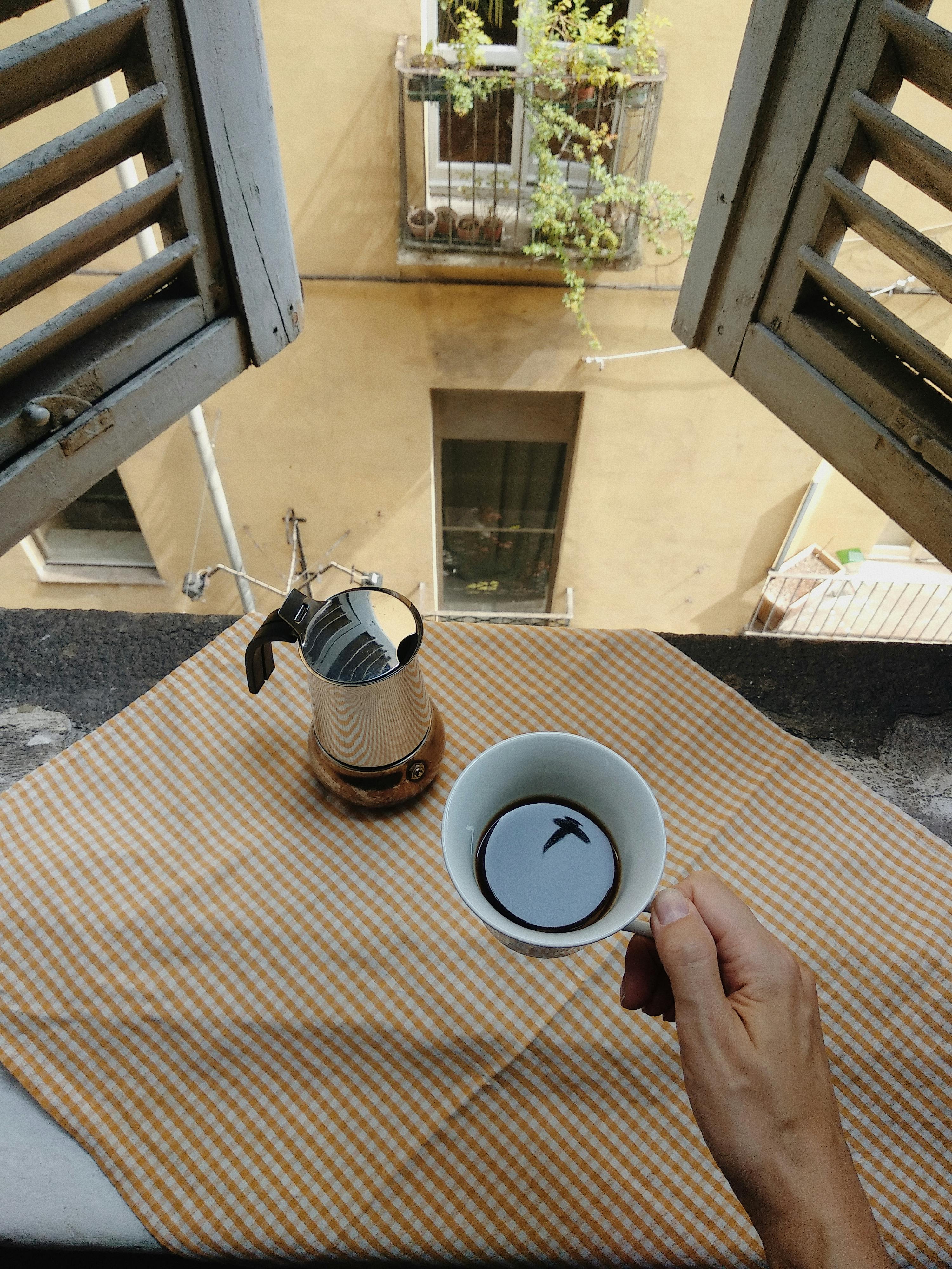 Morning Coffee on a Windowsill with Open Shutters · Free Stock Photo