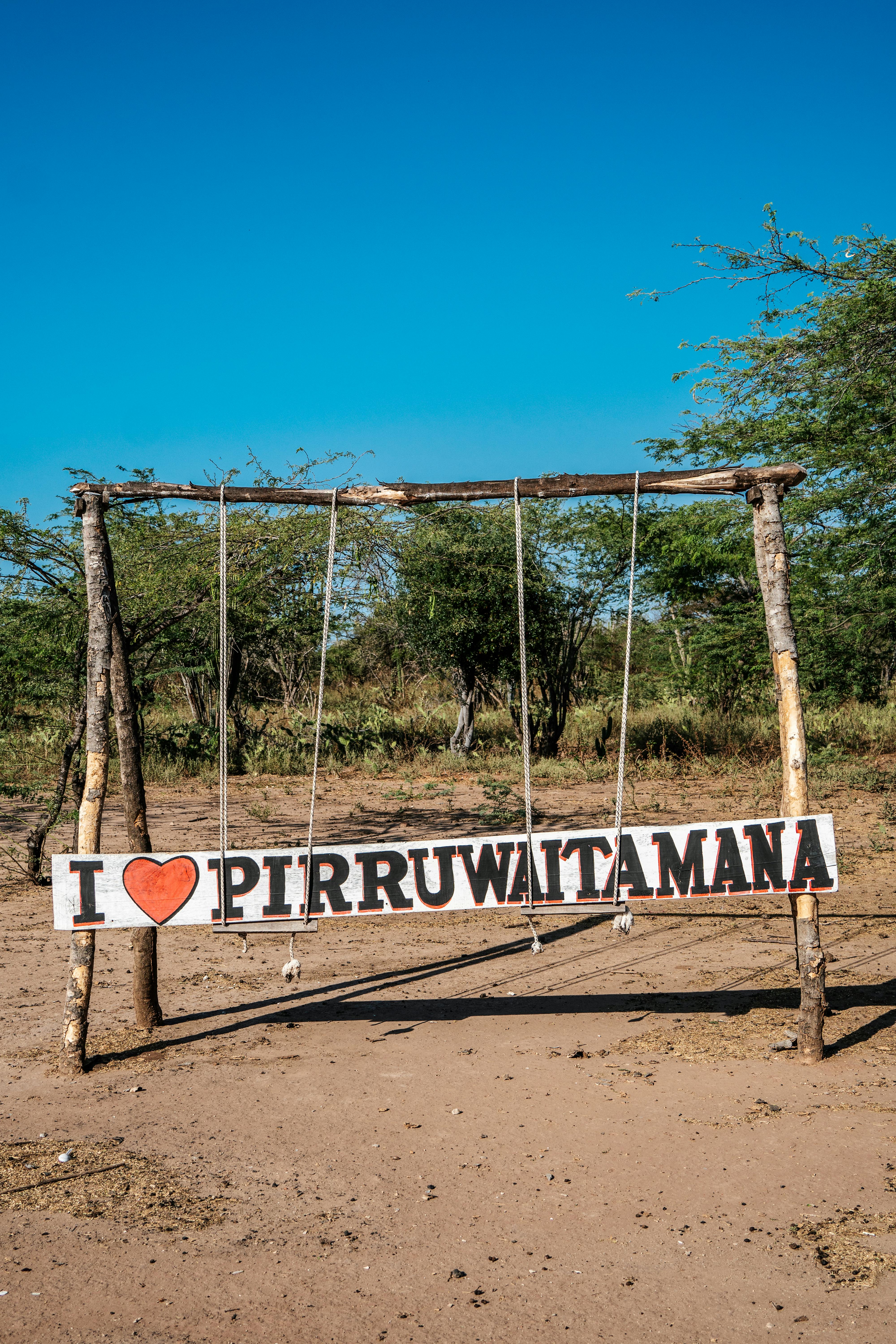 Swing and Text on Sandy Desert, Guajira, Colombia · Free Stock Photo