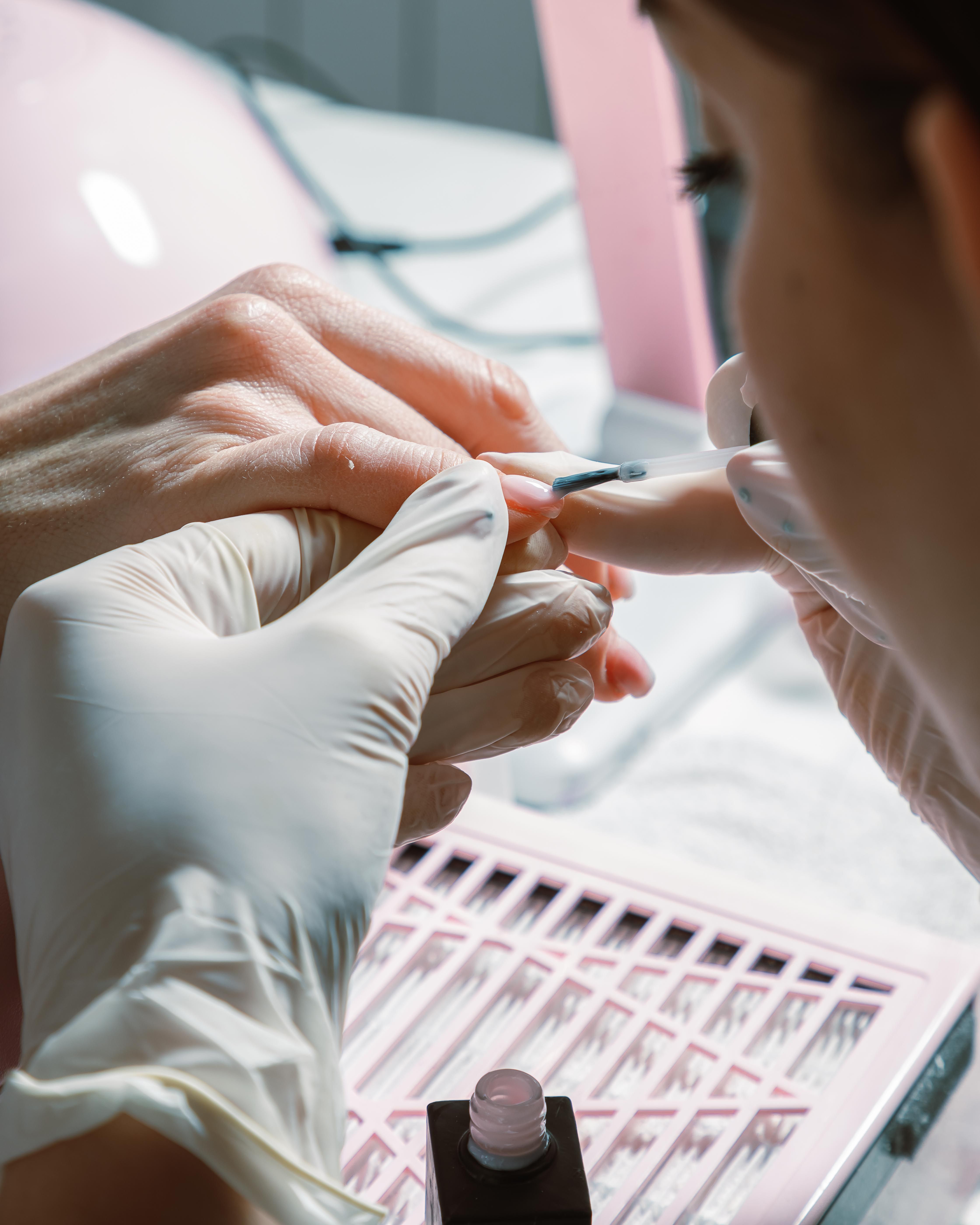 Woman Getting a Manicure · Free Stock Photo