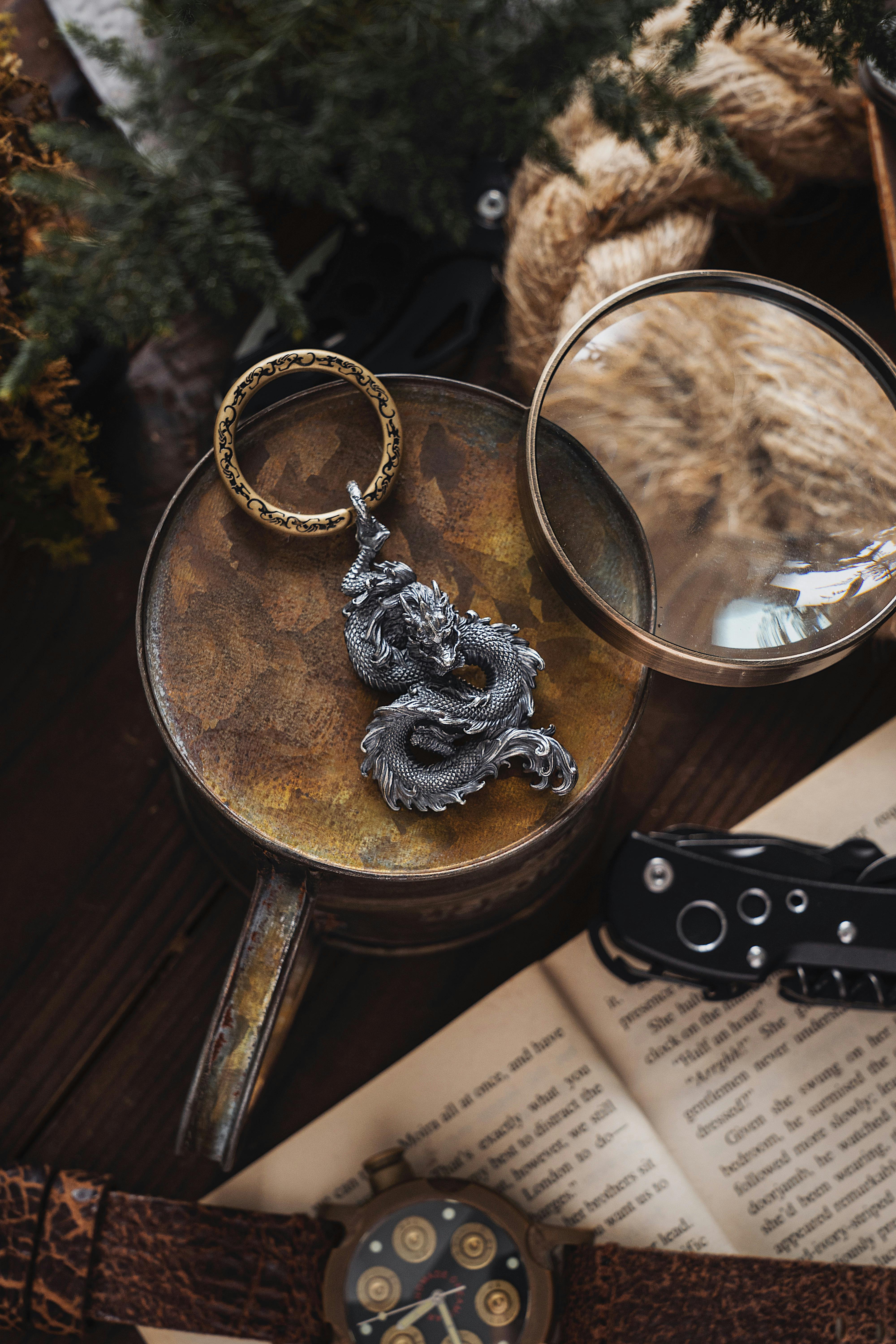 Dragon Pendant on Rusty Metal Cup · Free Stock Photo