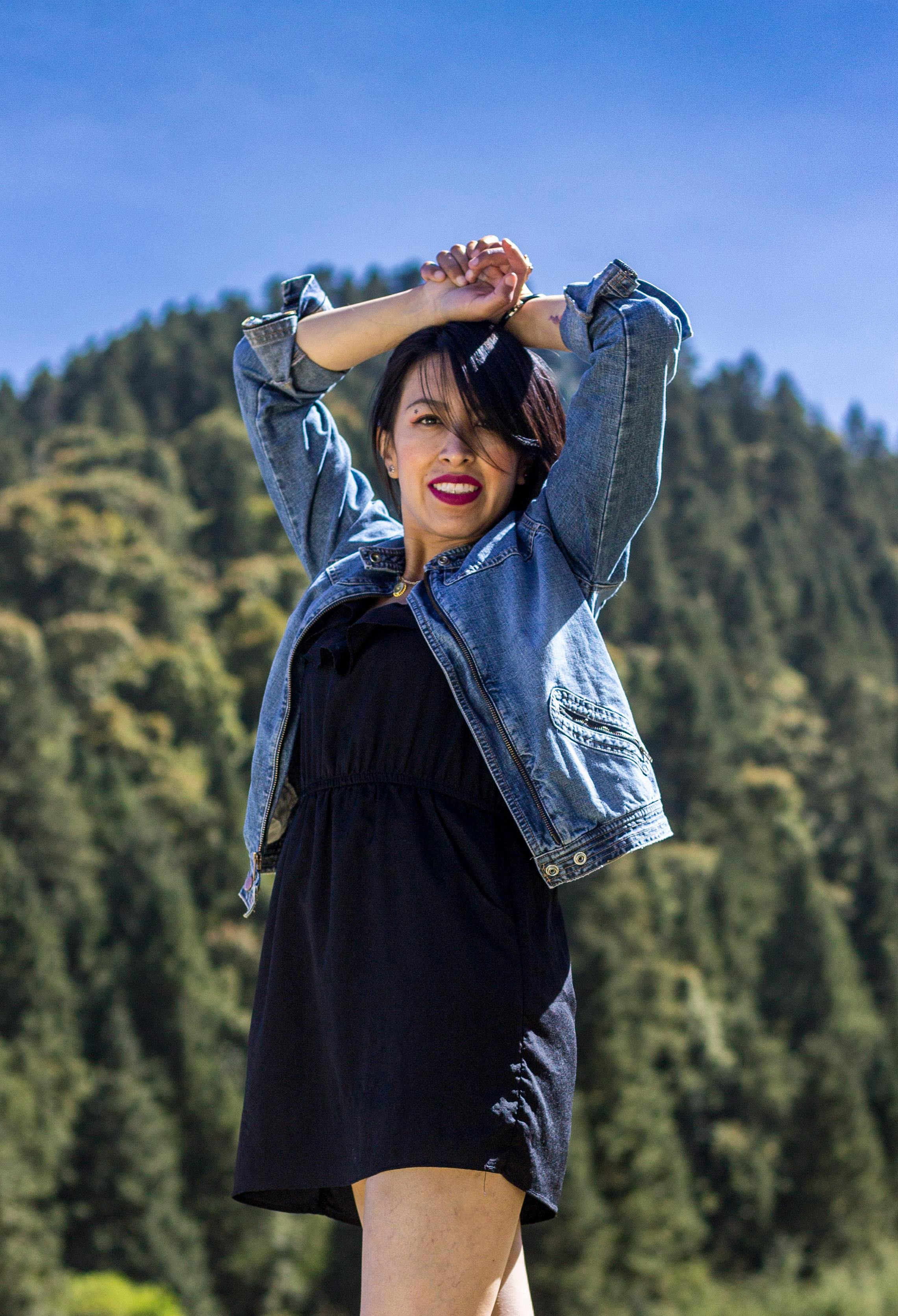 Photo of Woman Raising Her Both Arms · Free Stock Photo