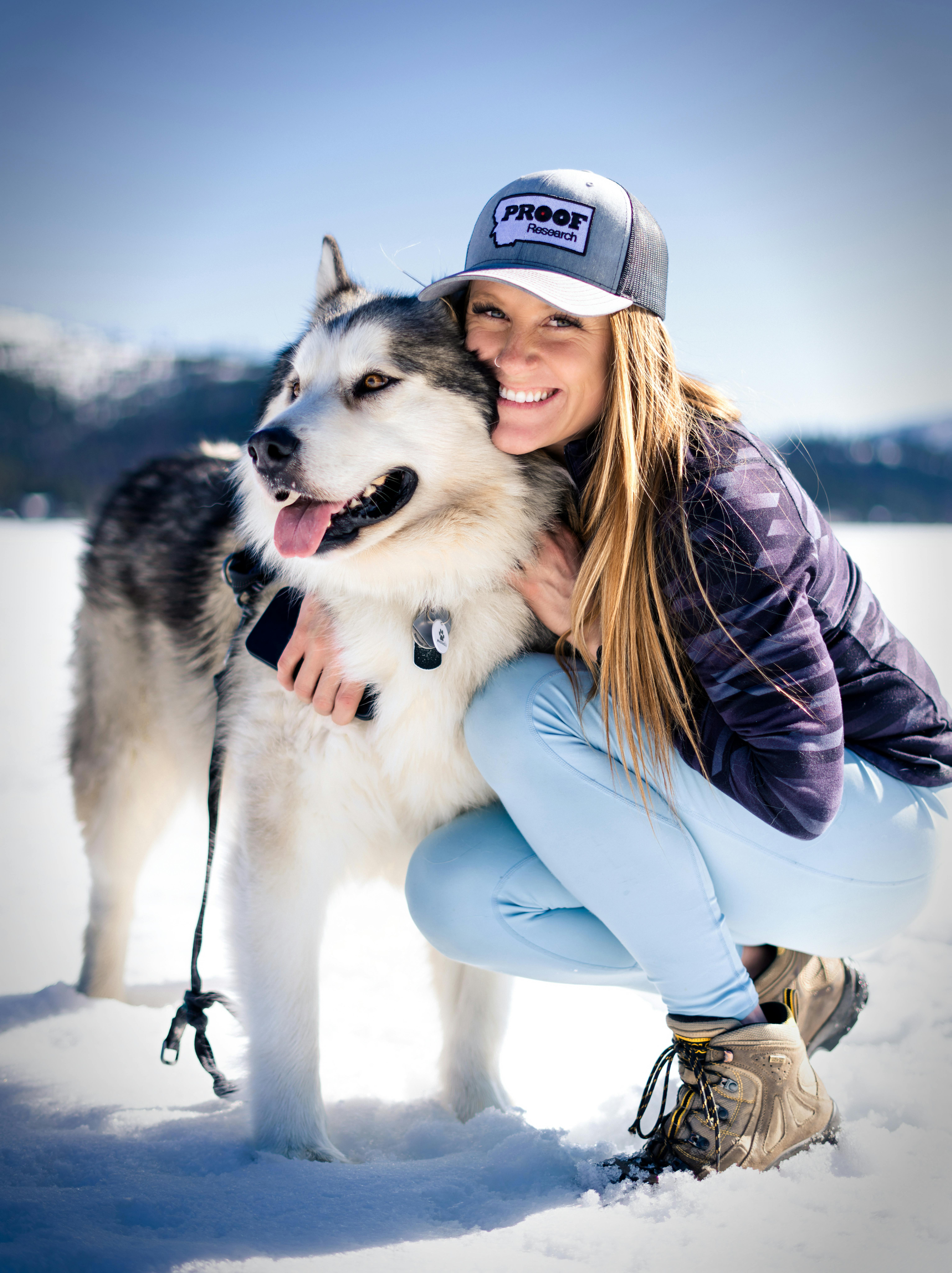 A Woman Posing with a Dog · Free Stock Photo