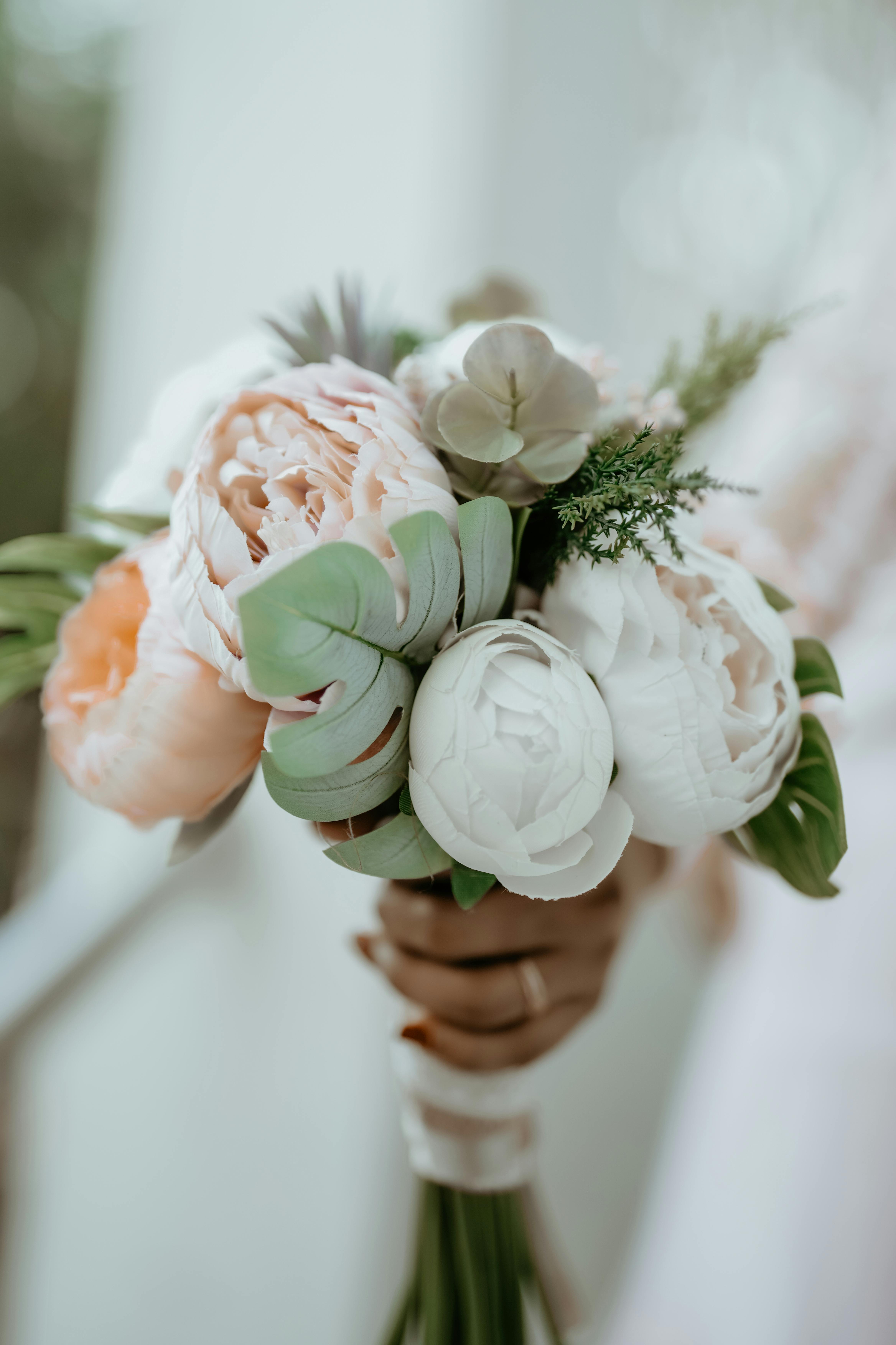 Close-up of Bride Holding Flowers Bouquet · Free Stock Photo