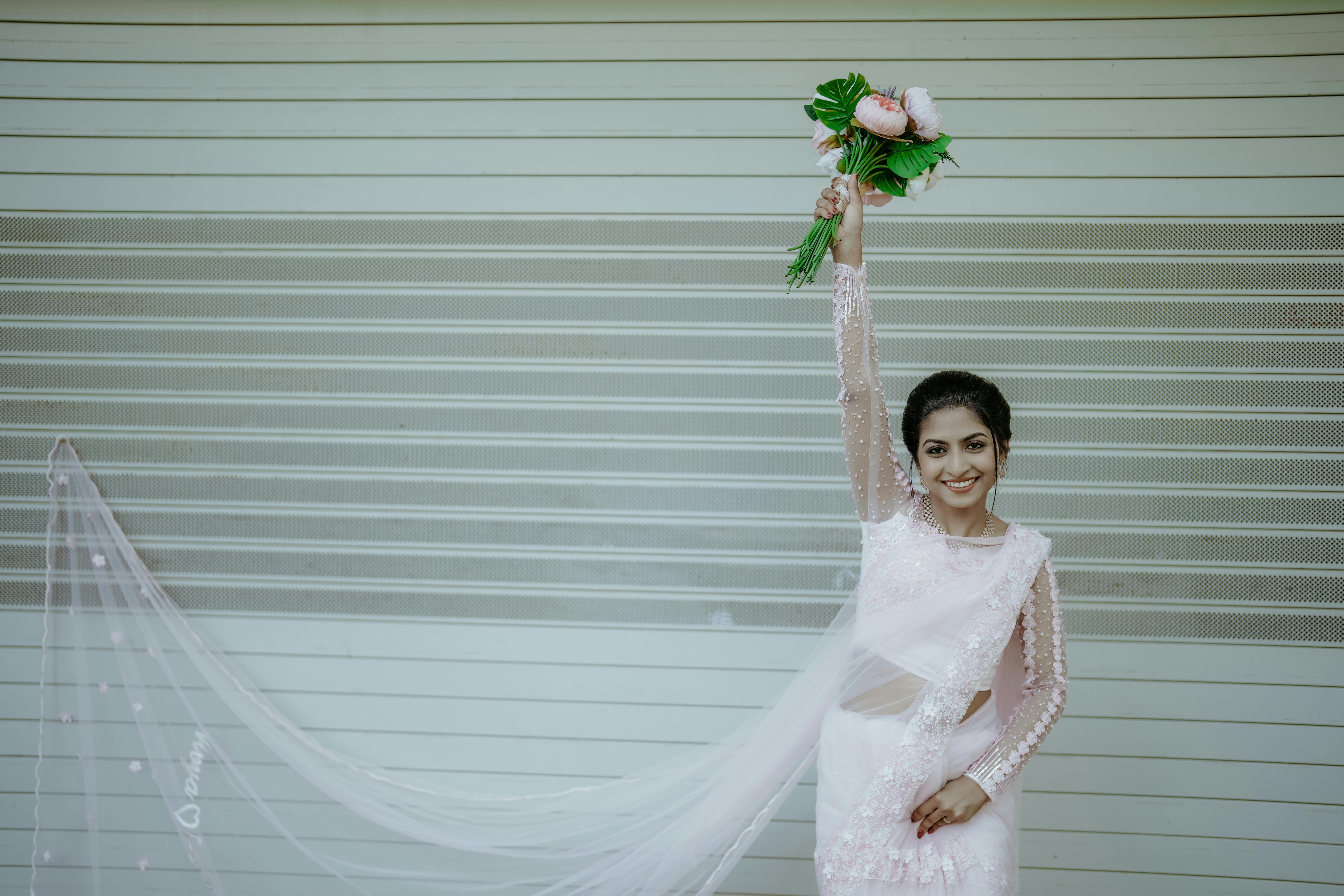 A Smiling Bride with a Sunflower · Free Stock Photo