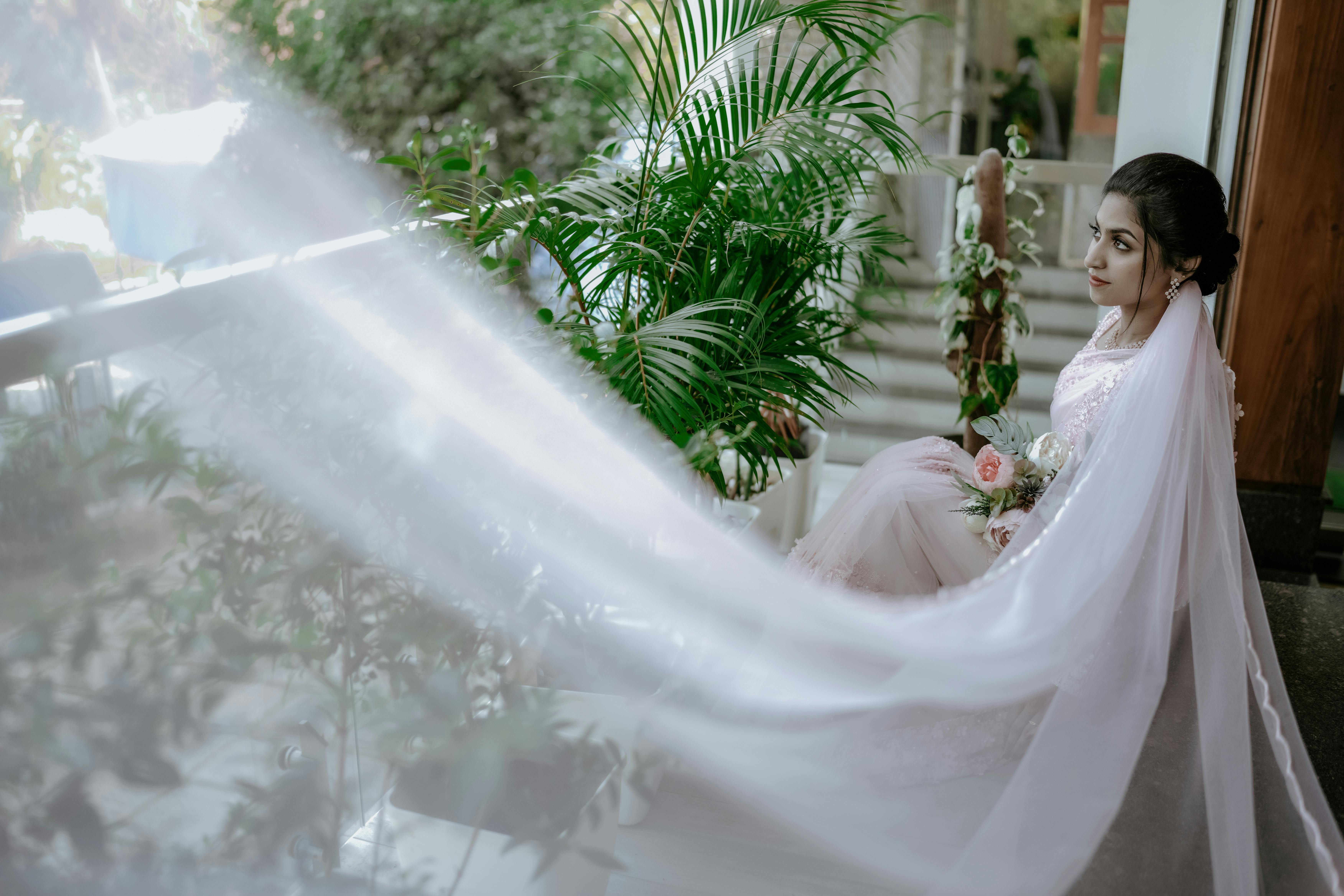 Sitting Bride in Wedding Dress with Veil · Free Stock Photo
