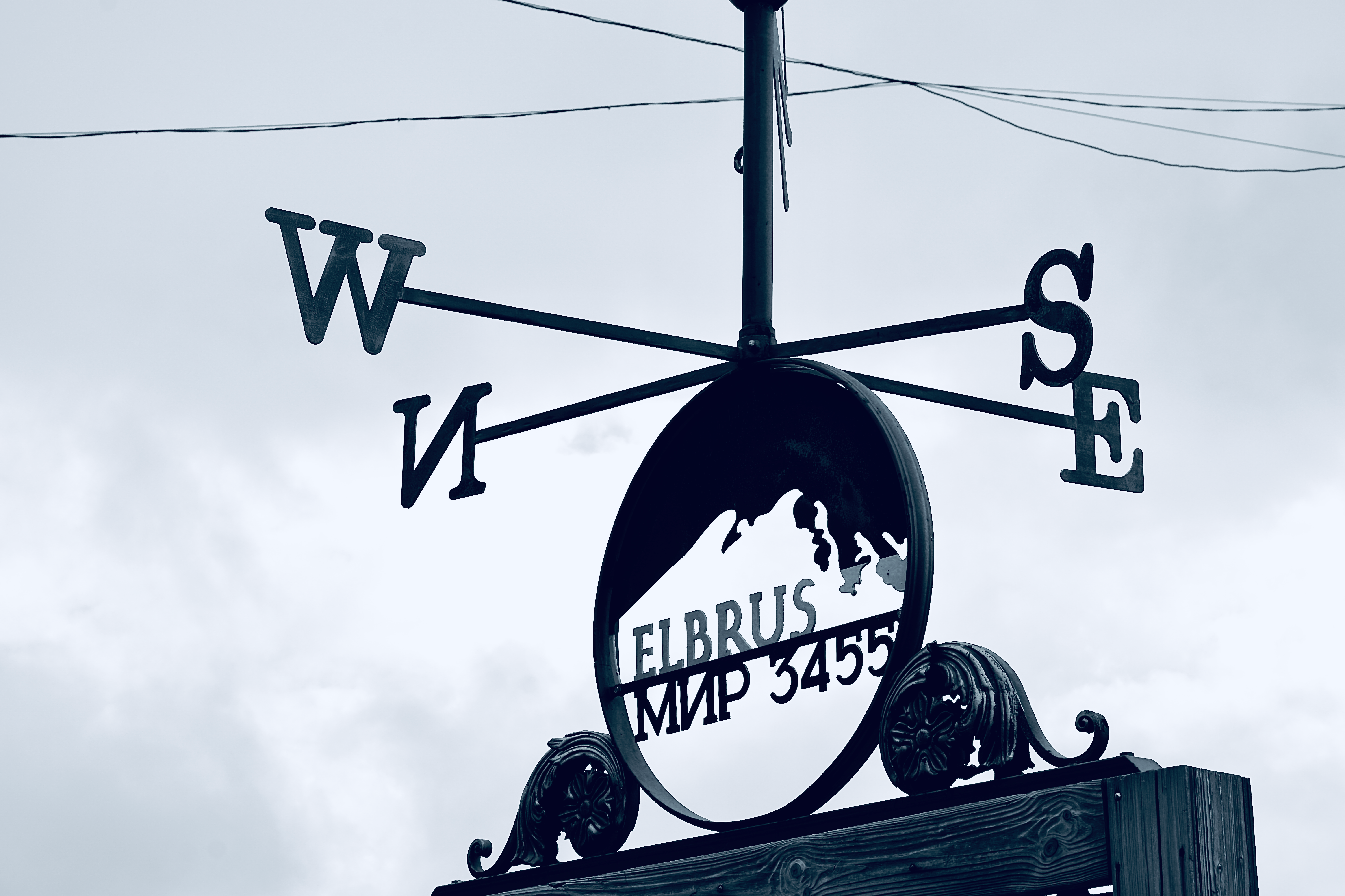Cardinal Directions on Metal · Free Stock Photo