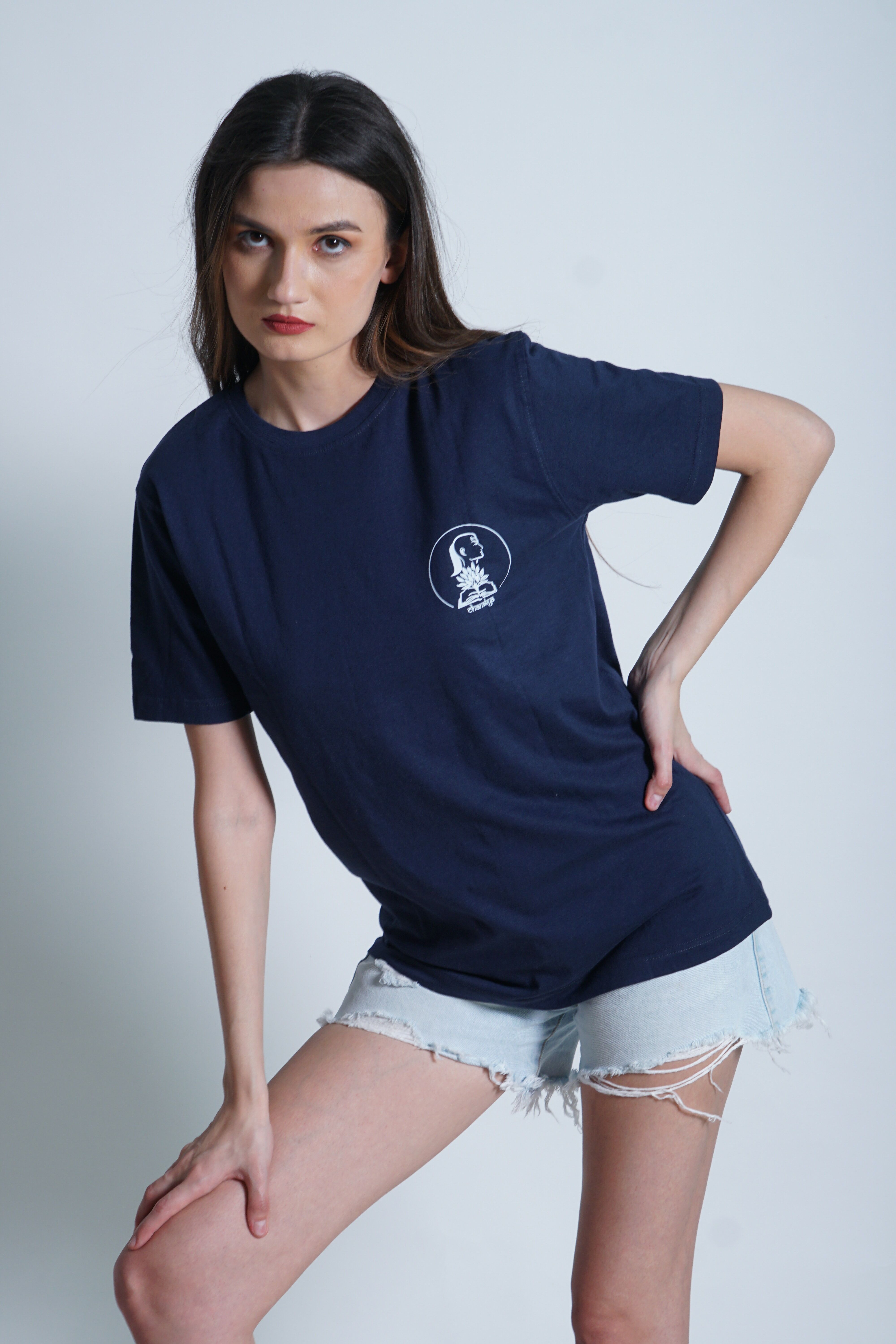 Young Model in a Pink T-shirt and Jeans Posing in the Studio · Free ...