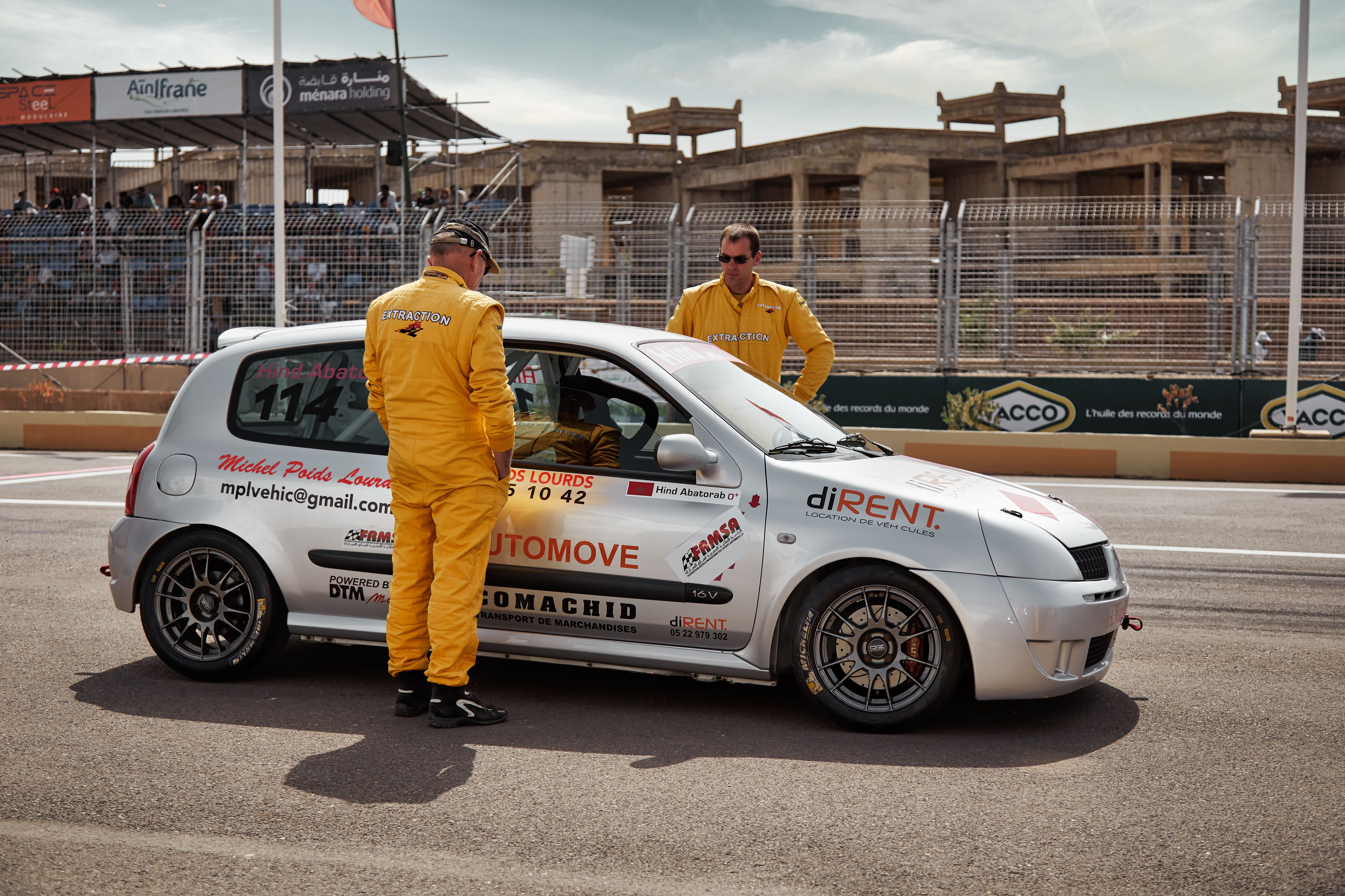 Men Standing Near Race Car · Free Stock Photo