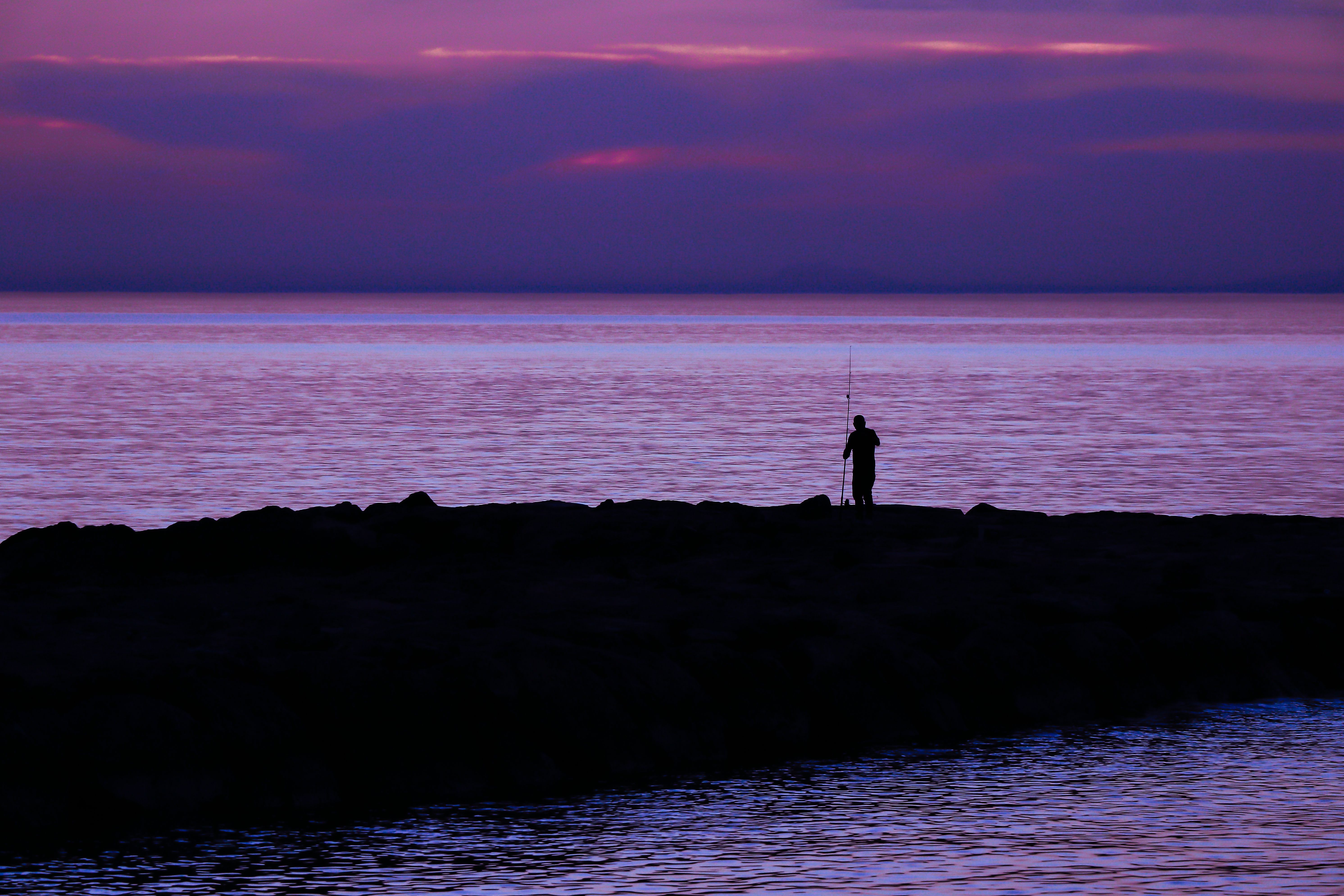 Fishermen on Shore under Purple Sky · Free Stock Photo