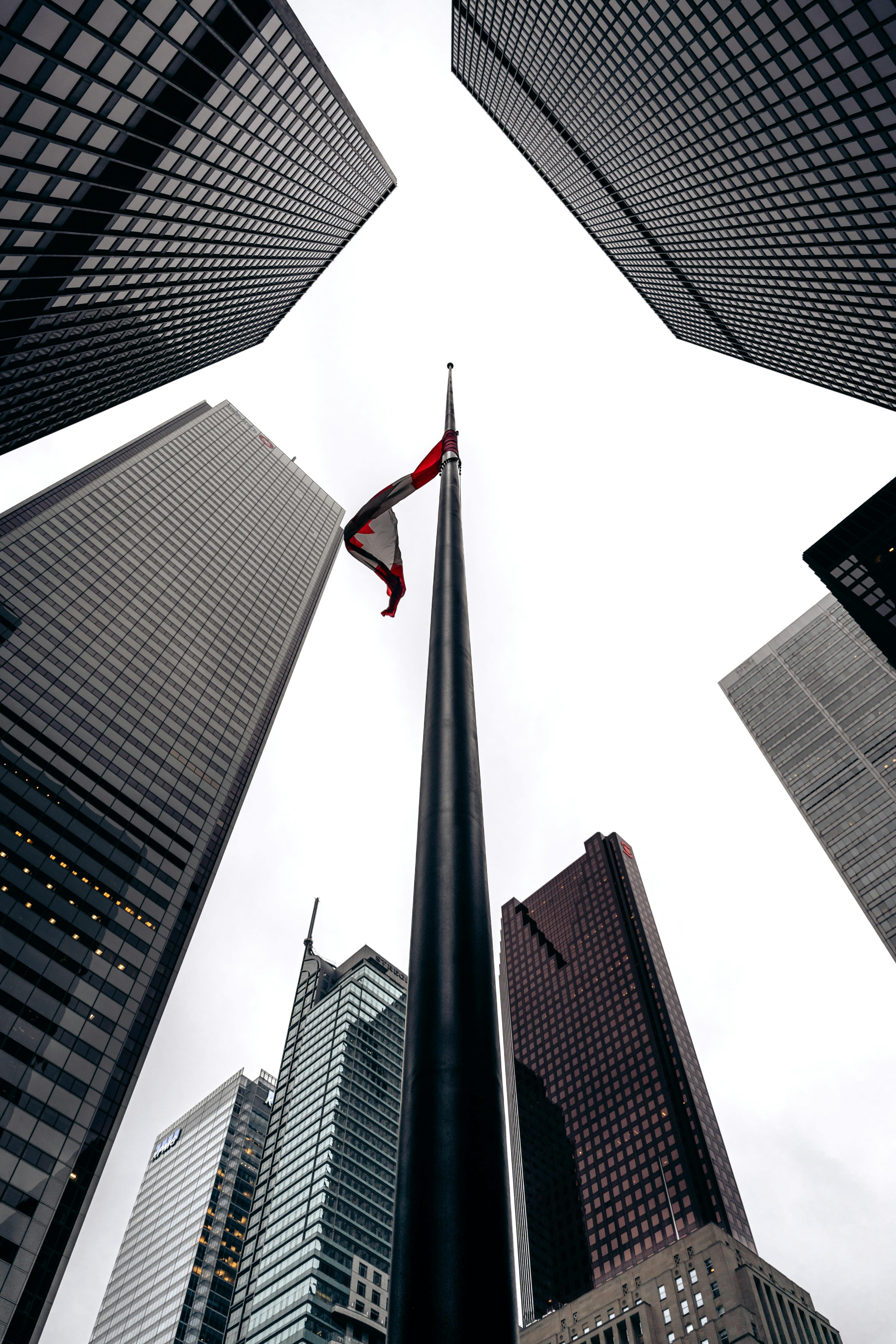 Flagpole among Skyscrapers · Free Stock Photo