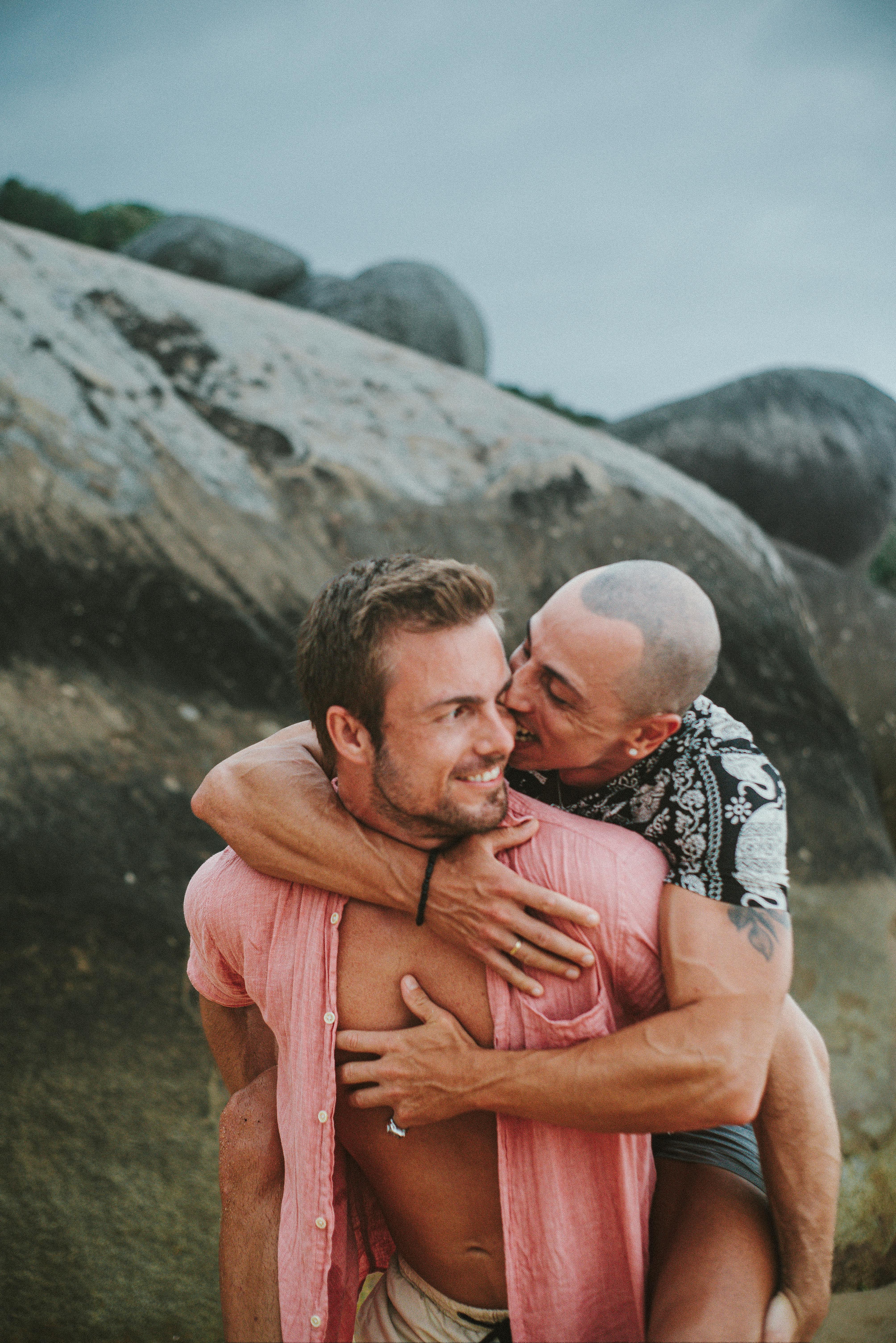Man being Carried by His Partner and Kissing Him · Free Stock Photo