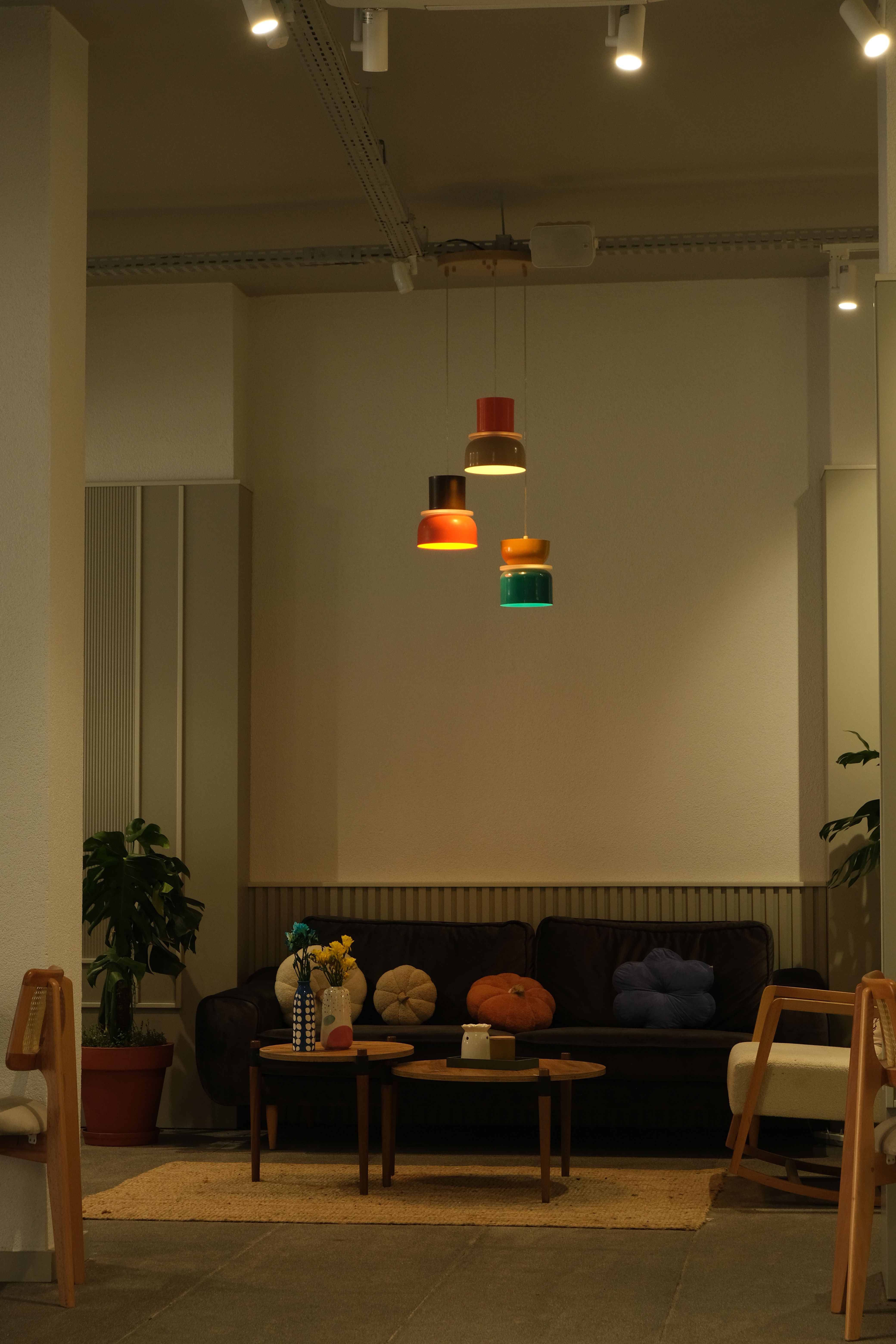 Colorful Lamps Hanging above a Sofa and Tables in a Modern Interior ...