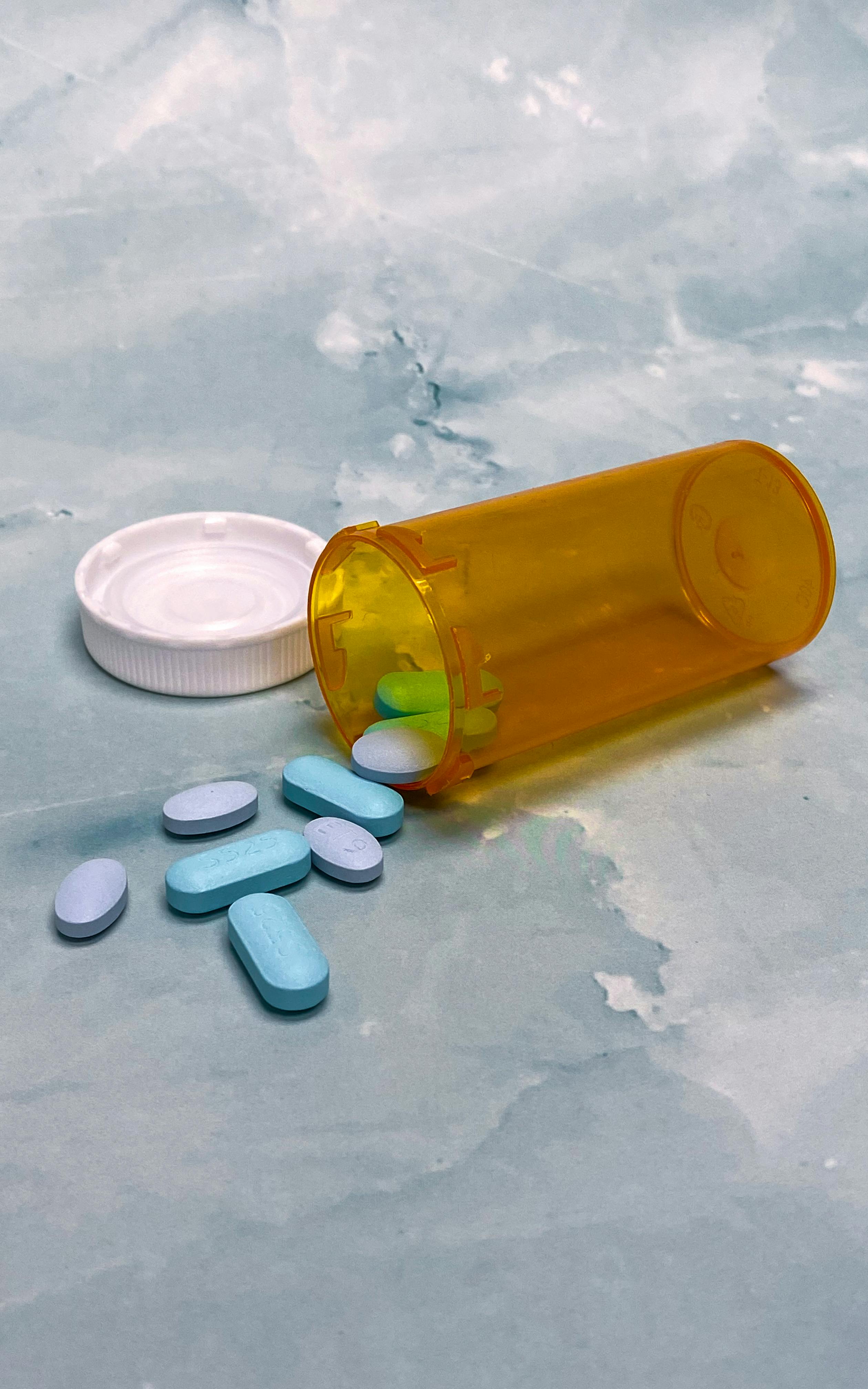 Pills Spill With A Blue Background Photos, Download The BEST Free Pills ...