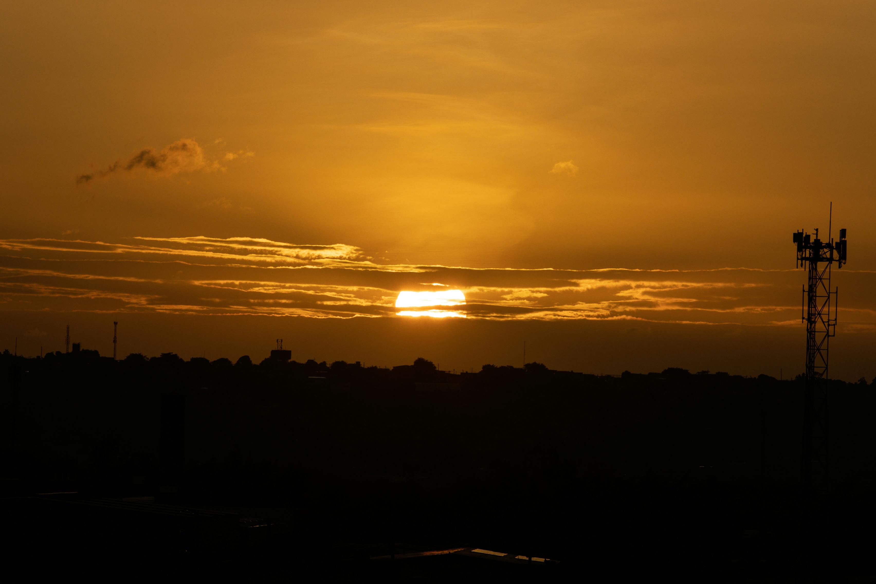 Yellow Sky over Sea Coast at Sunset · Free Stock Photo